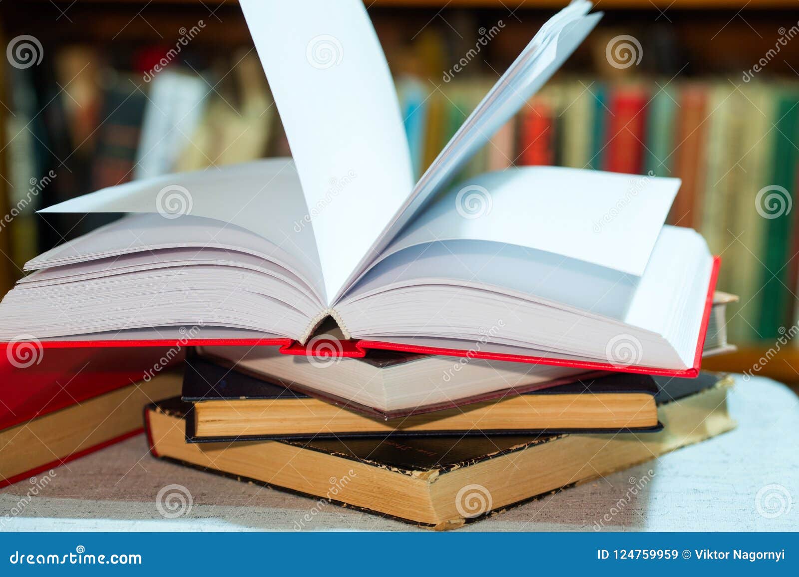 Open Book, Stack of Hardback Books on Table. Top View. Stock Image ...