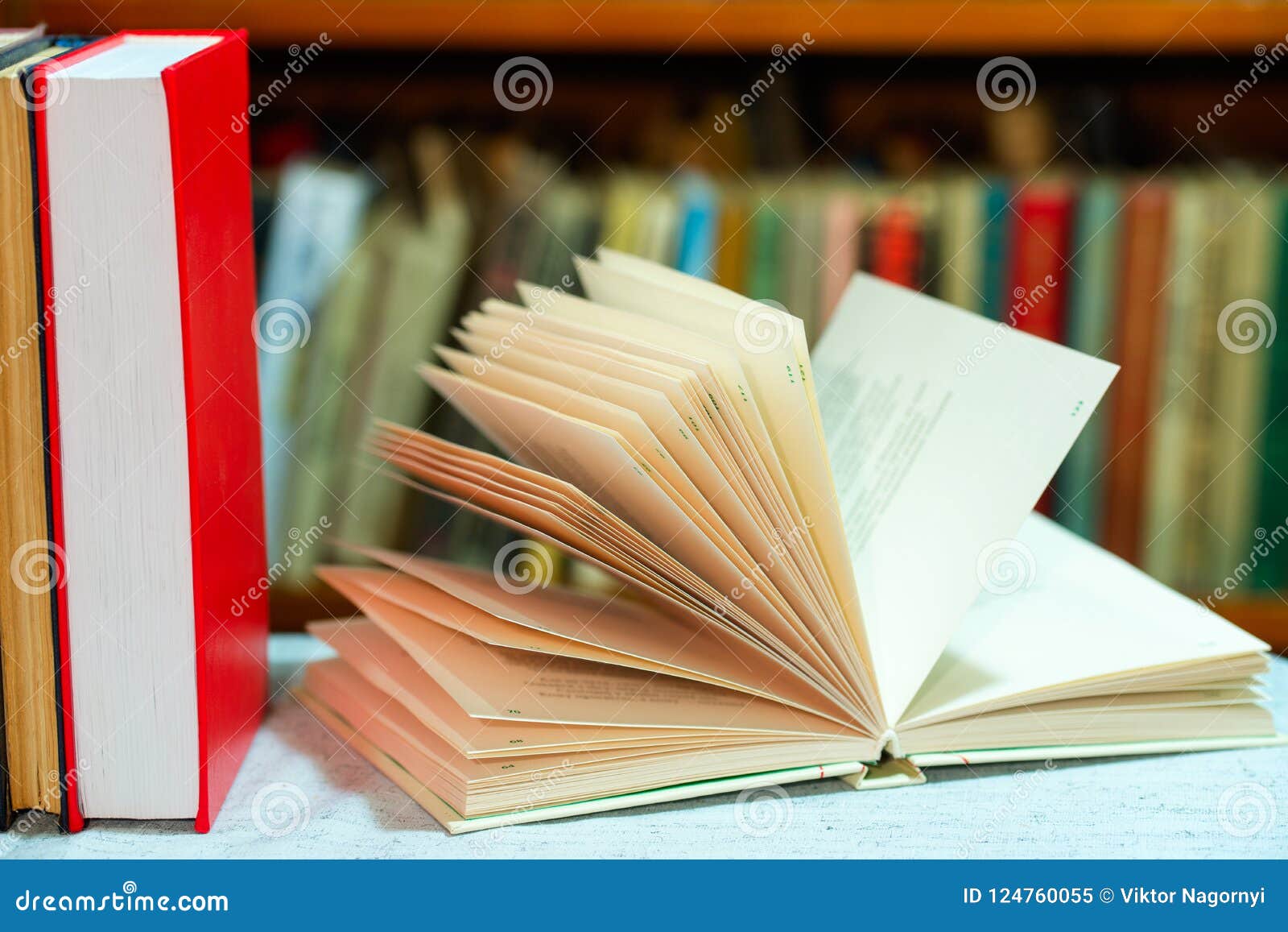 Open Book, Stack of Hardback Books on Table. Top View. Stock Image ...