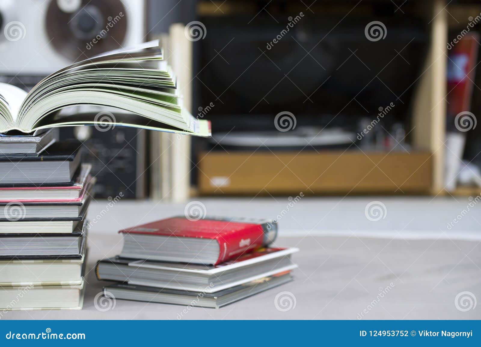 Open Book, Stack of Hardback Books on Table. Top View. Stock Photo ...