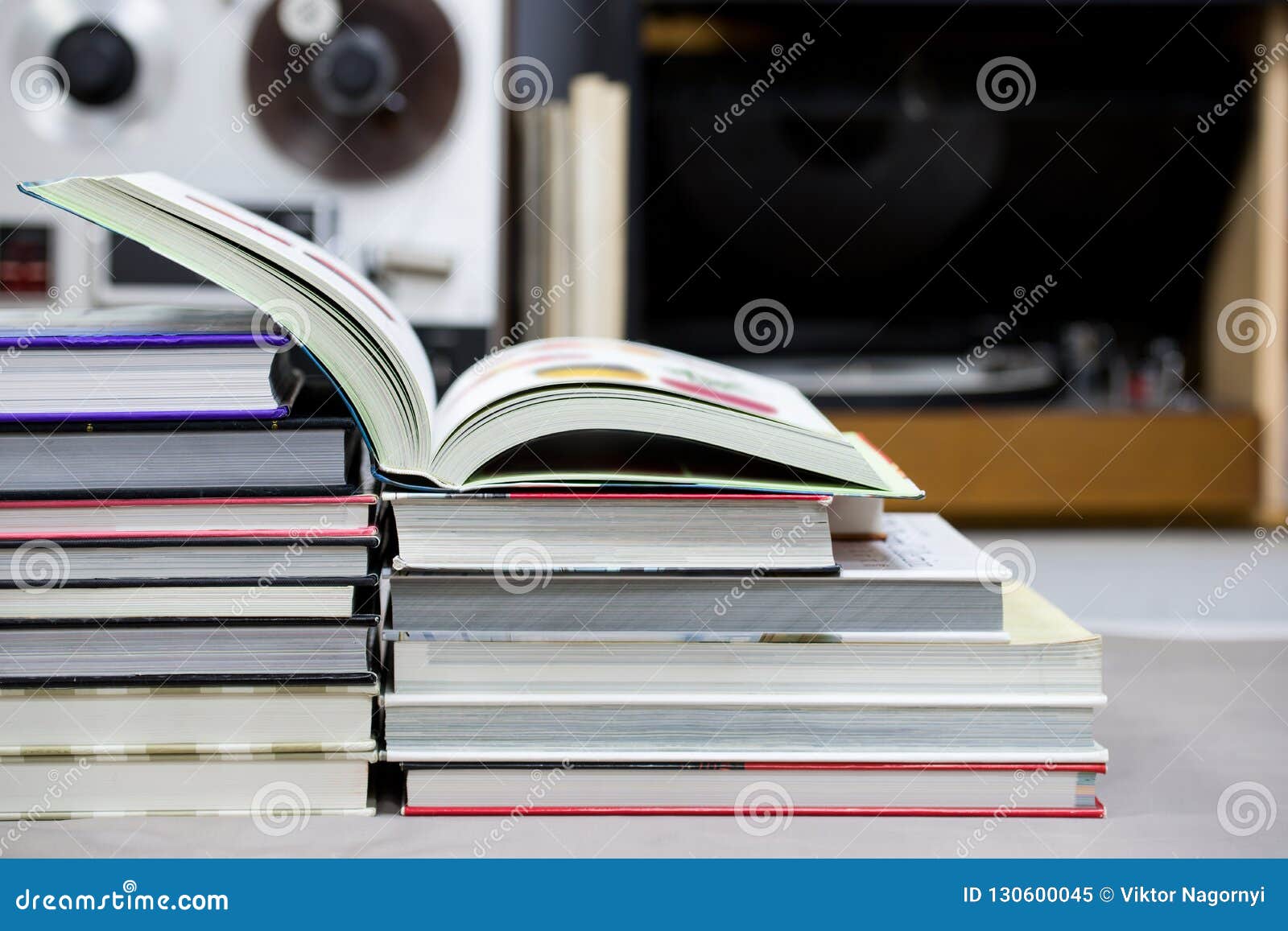 Open Book, Stack of Hardback Books on Table. Top View. Stock Image ...
