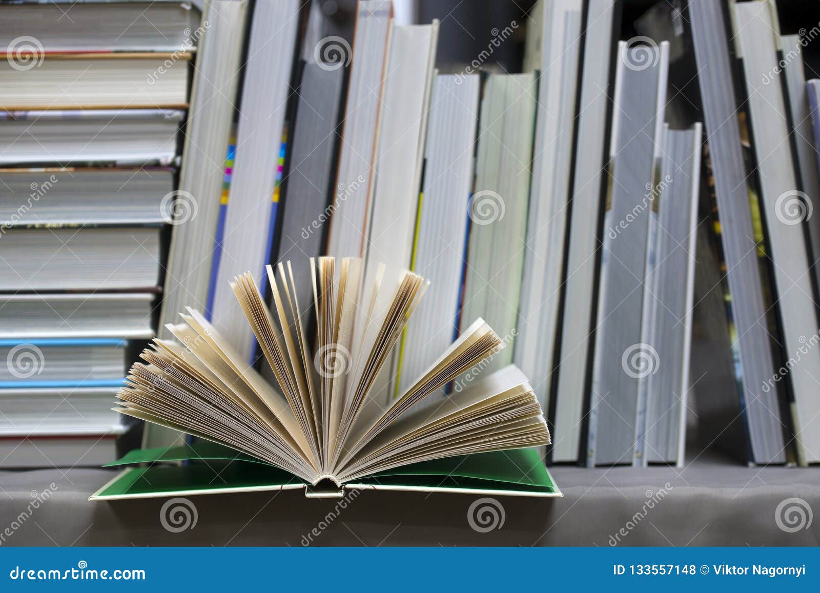 Open Book, Stack of Hardback Books on Table. Top View. Stock Photo ...