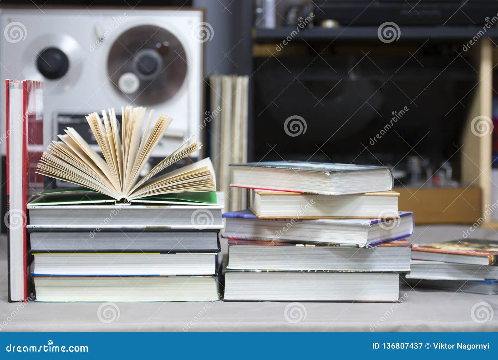 Open Book, Stack of Hardback Books on Table. Top View. Stock Image ...