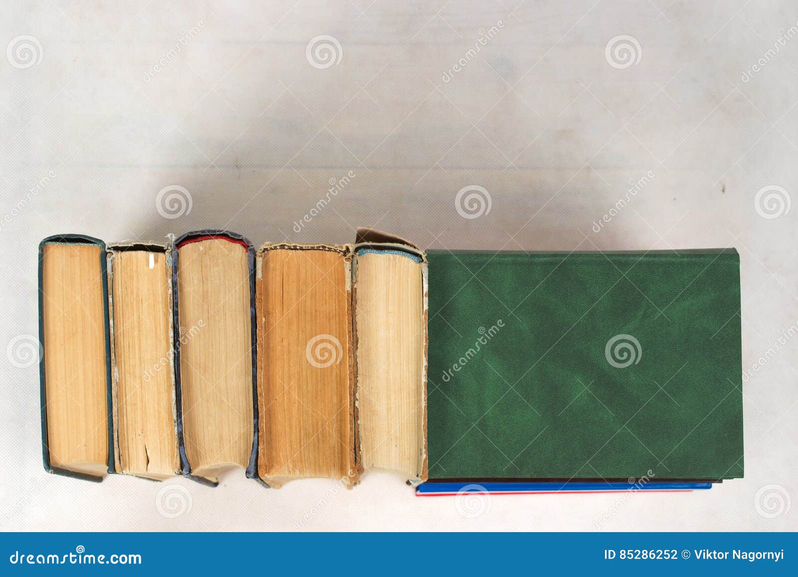 Open Book, Stack of Hardback Books on Table. Top View. Stock Photo ...