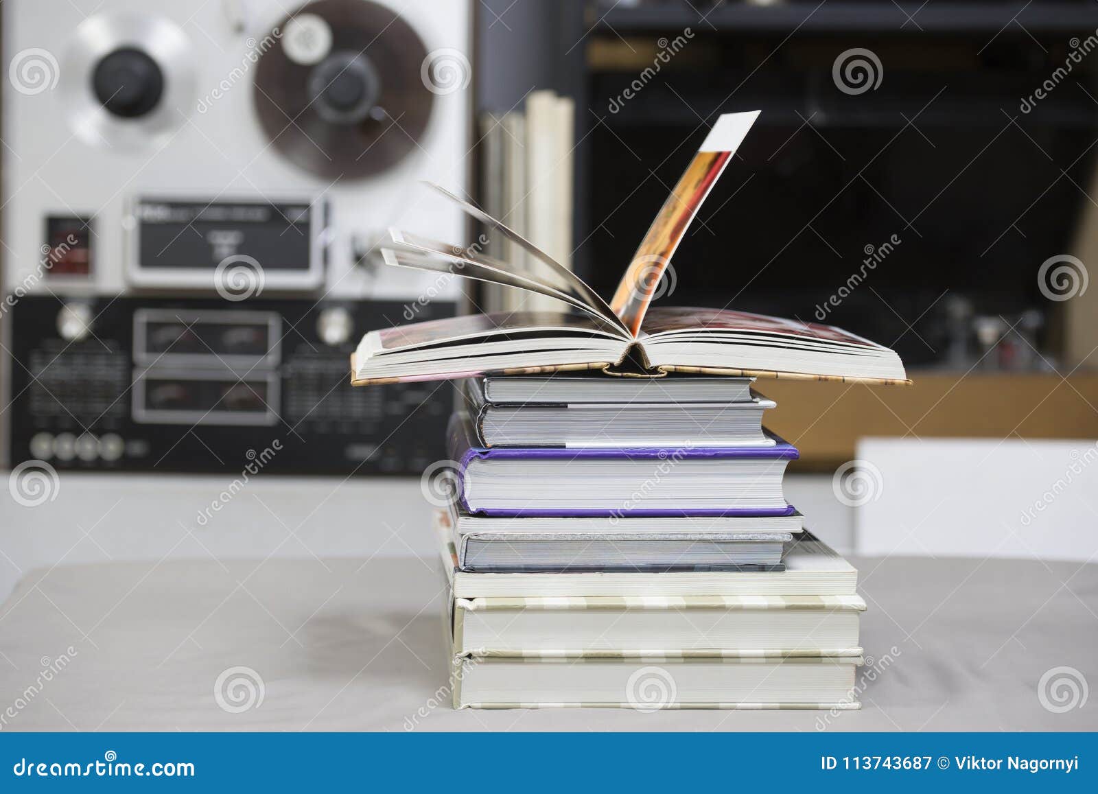 Open Book, Stack of Hardback Books on Table. Top View. Stock Image ...