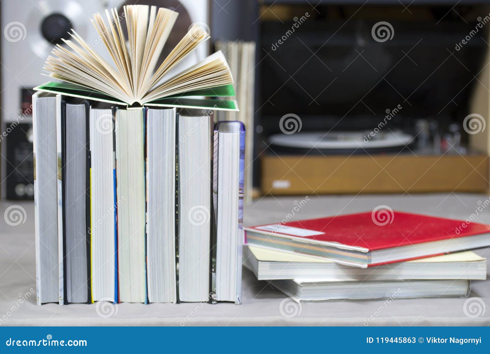 Open Book, Stack of Hardback Books on Table. Top View. Stock Image ...