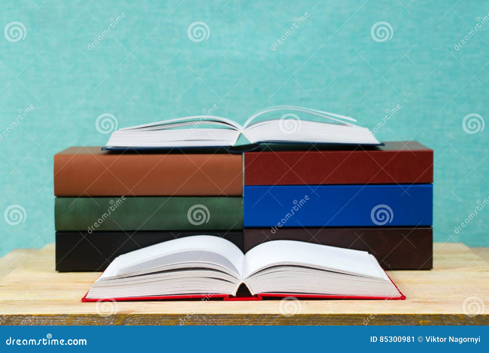 Open Book, Stack of Hardback Books on Wooden Table. Stock Image - Image ...