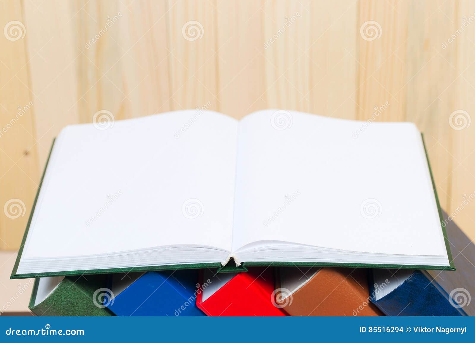 Open Book, Stack of Hardback Books on Wooden Table. Stock Photo - Image ...