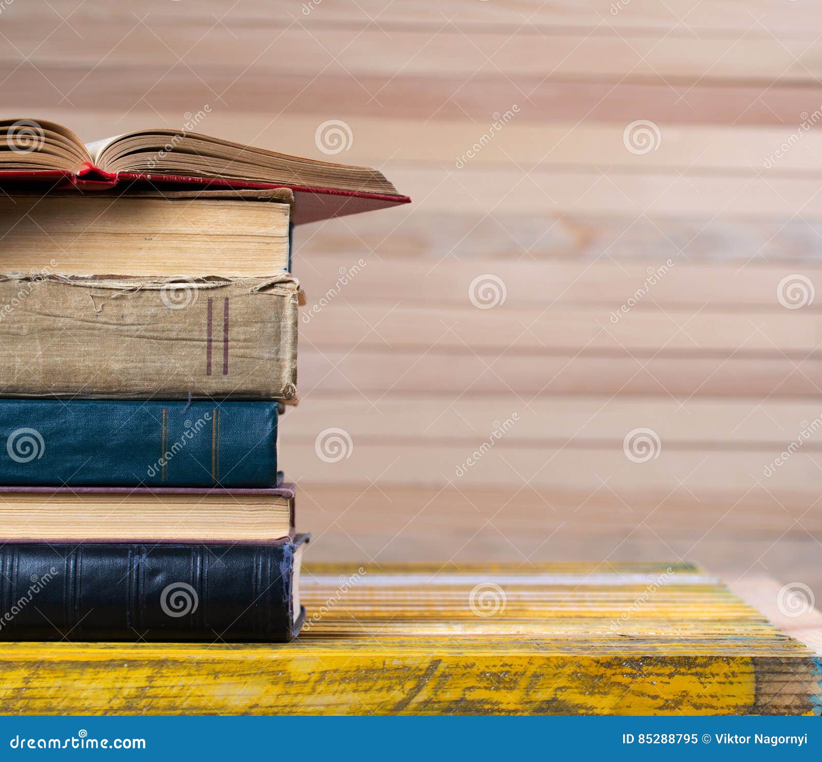 Open Book, Stack of Hardback Books on Wooden Table. Stock Image - Image ...