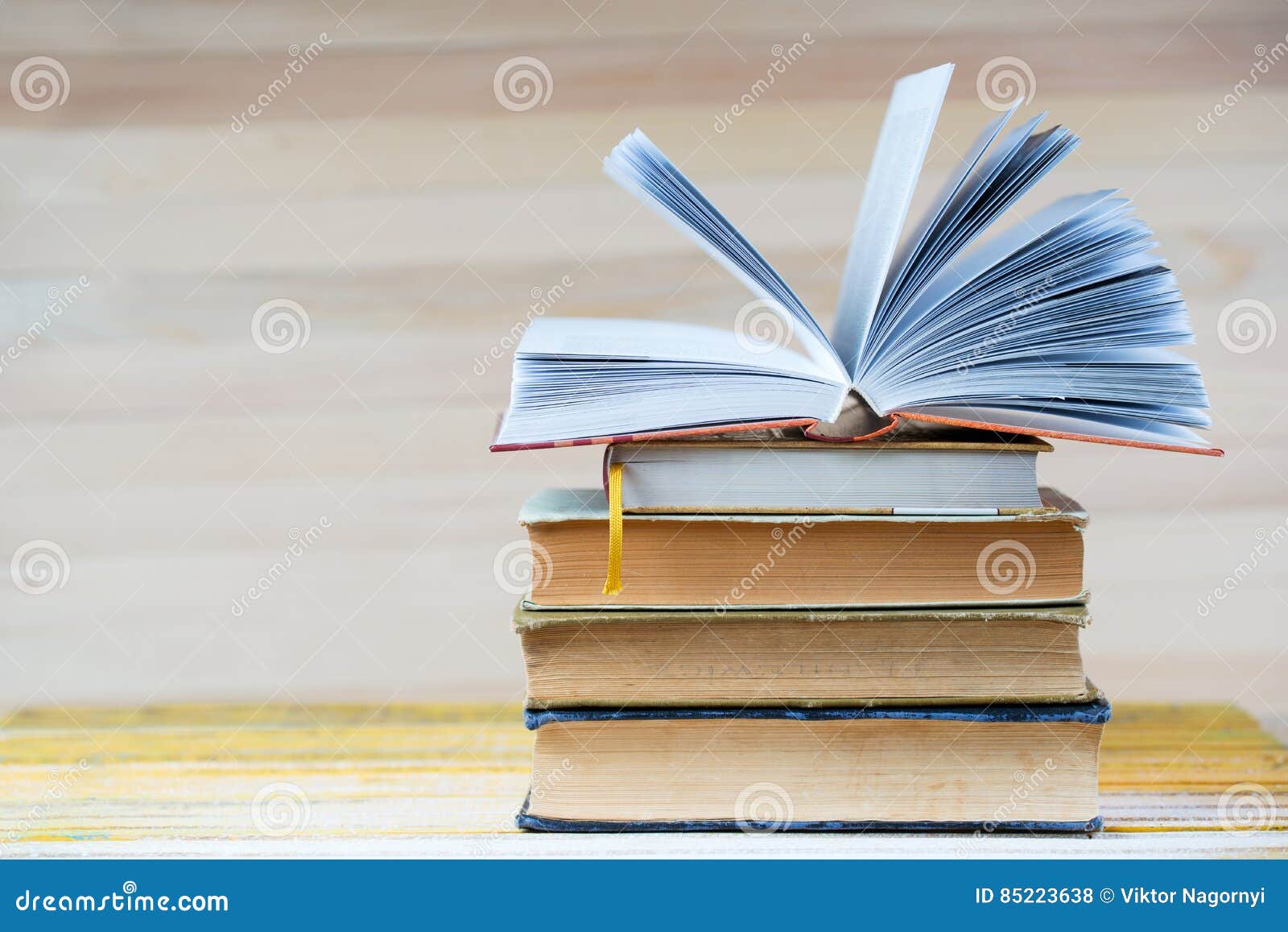 Open Book, Stack of Hardback Books on Wooden Table. Stock Photo - Image ...