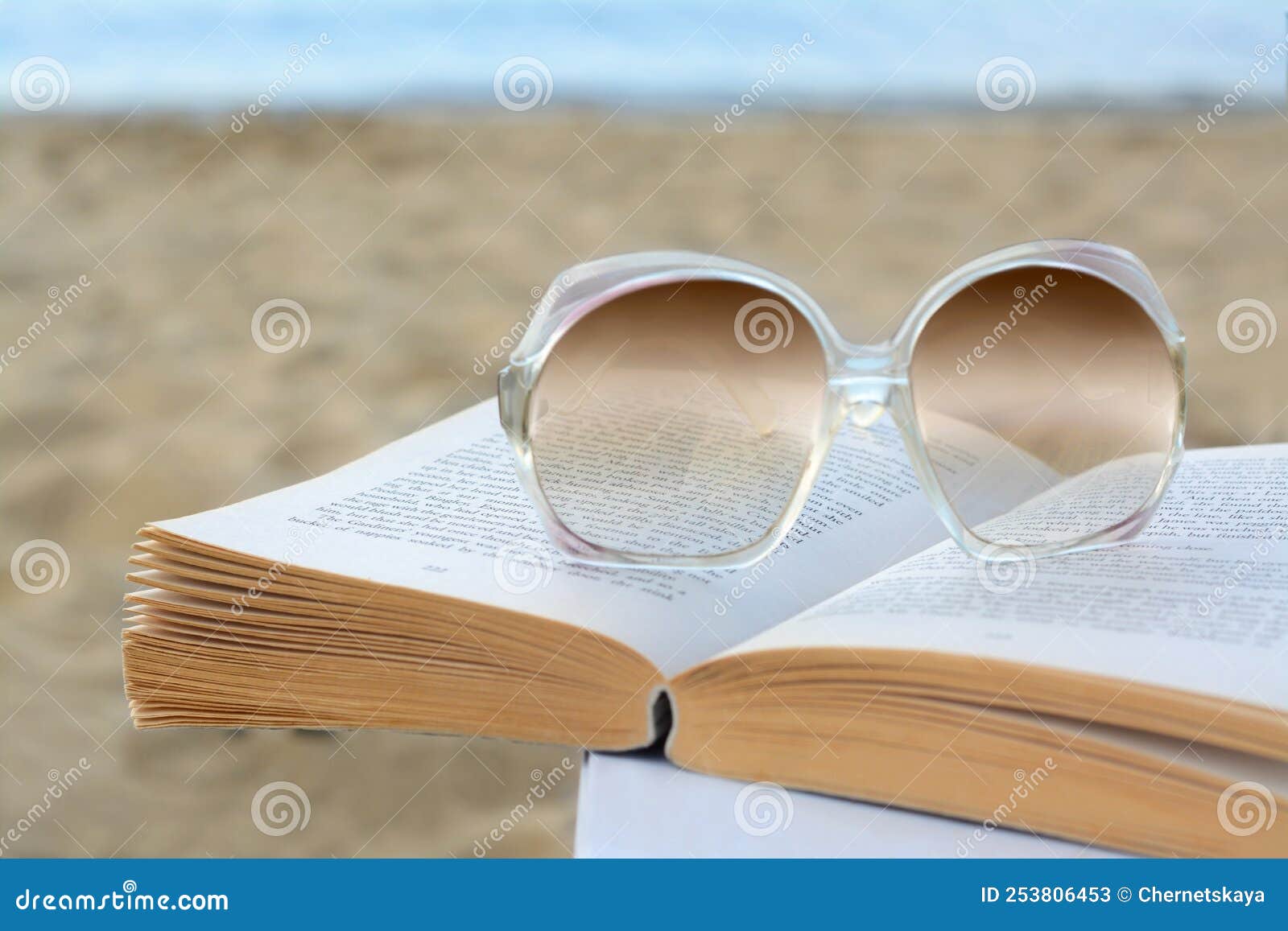 Open Book and Sunglasses on Beach, Closeup Stock Image - Image of open ...