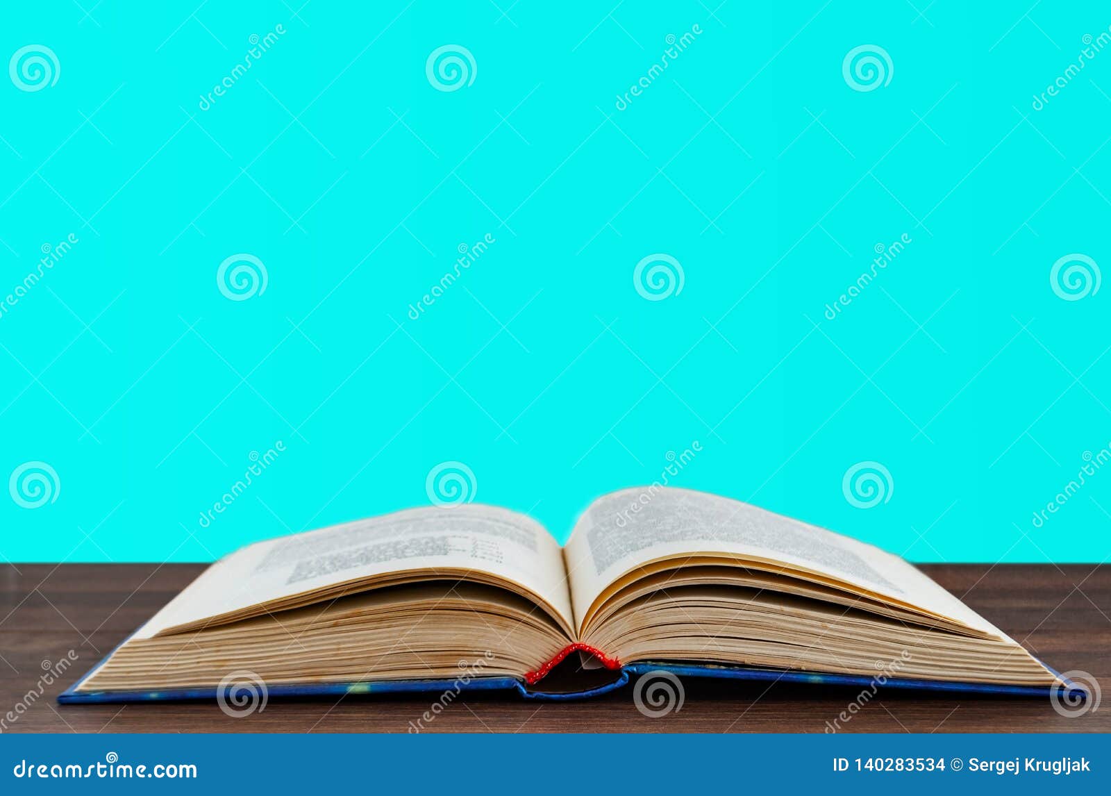 Open Book on the Surface on a Blue Background Stock Photo - Image of ...