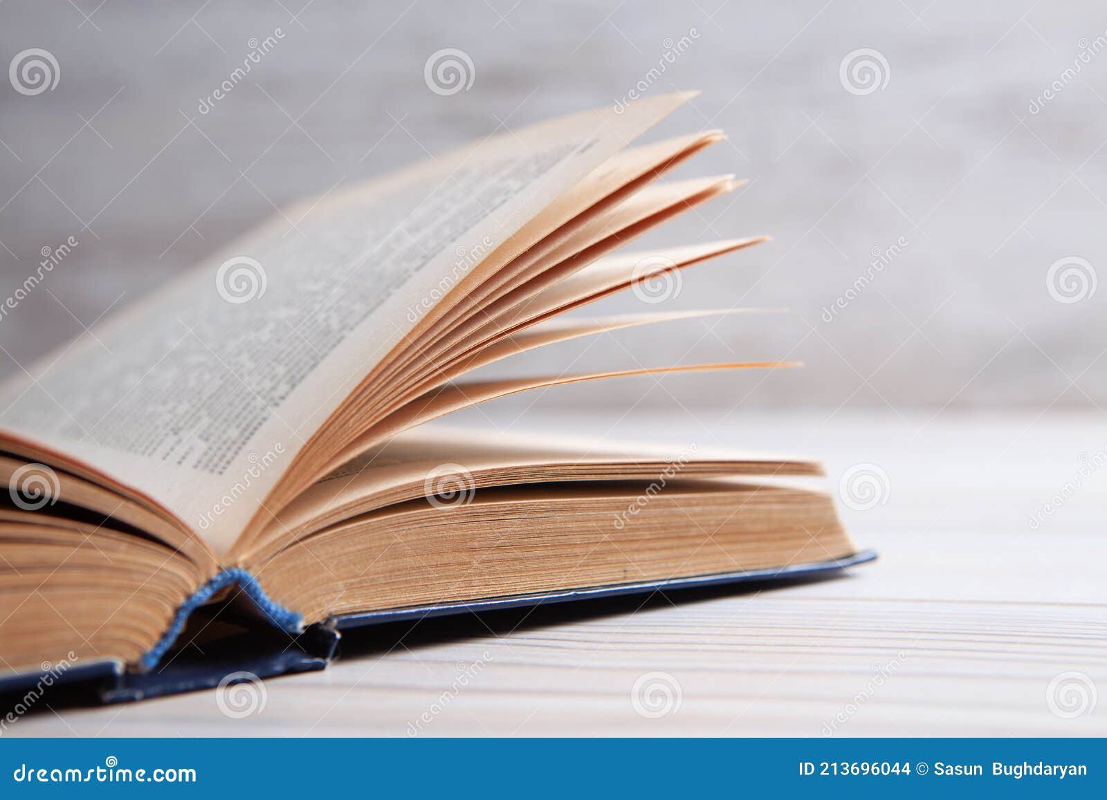 Open book on the table stock photo. Image of device - 213696044