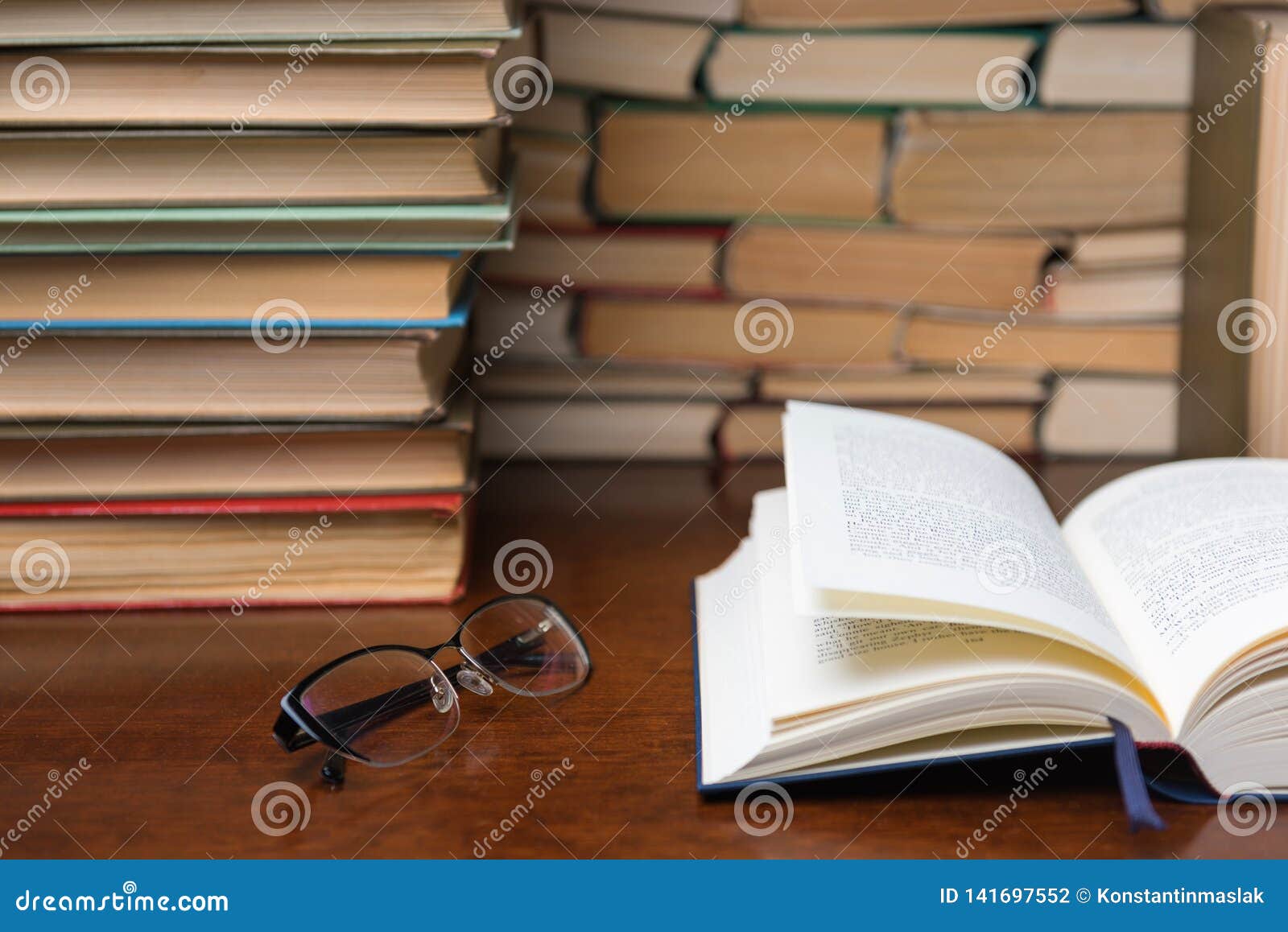 Book on the Table Against the Background of Books Stock Photo - Image ...