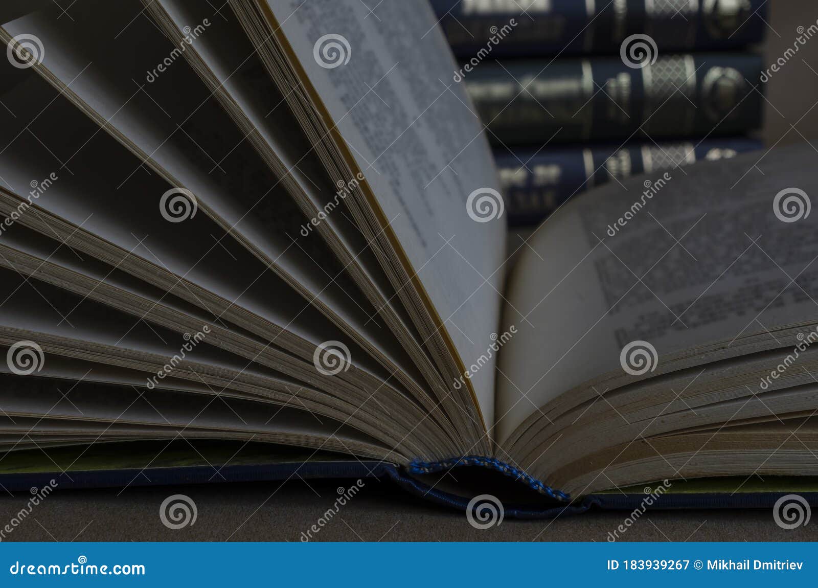 An Open Book on a Table in a Dark Library Stock Image - Image of indoor ...
