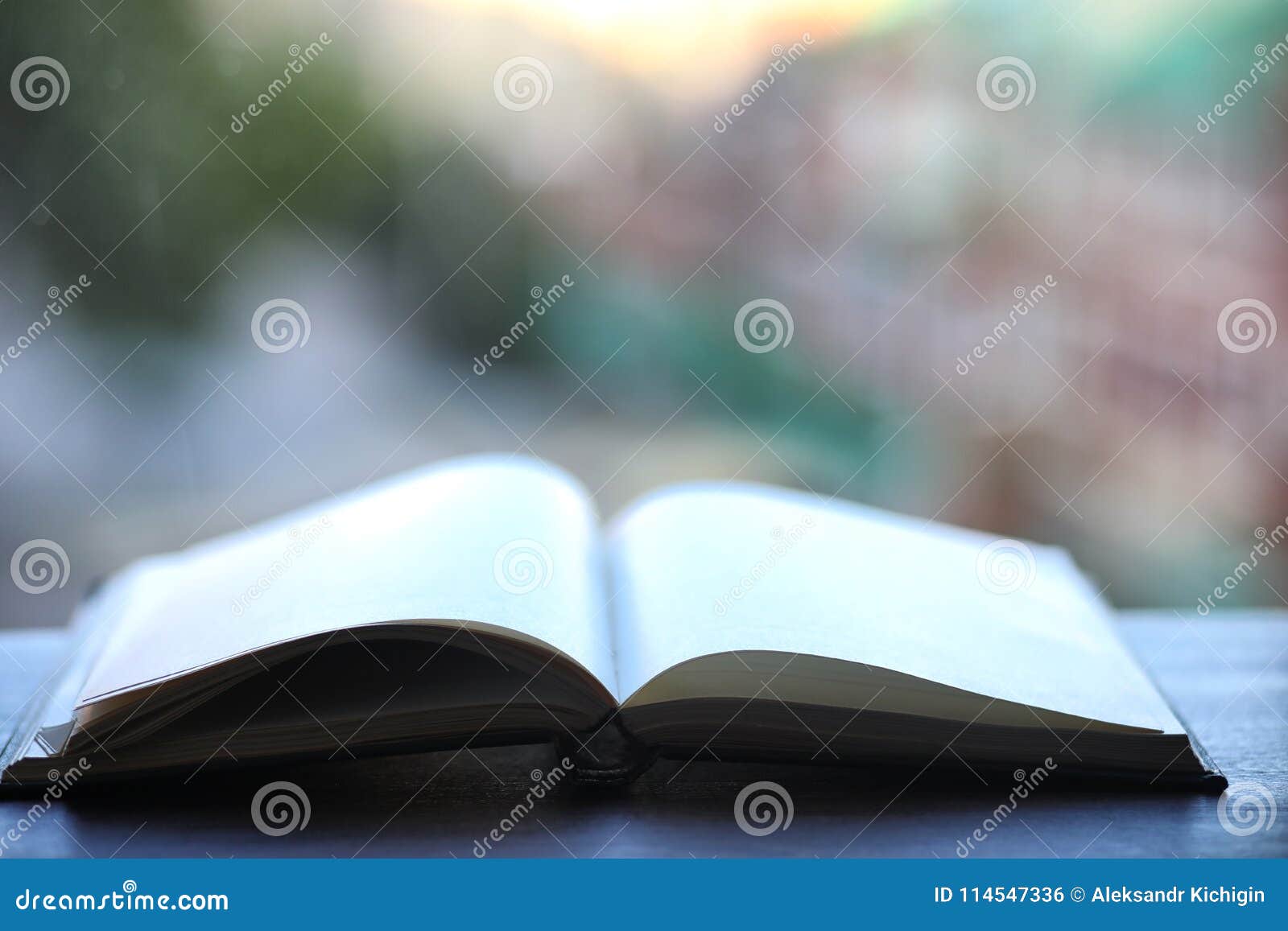 Open book and a table stock photo. Image of hardcover - 114547336