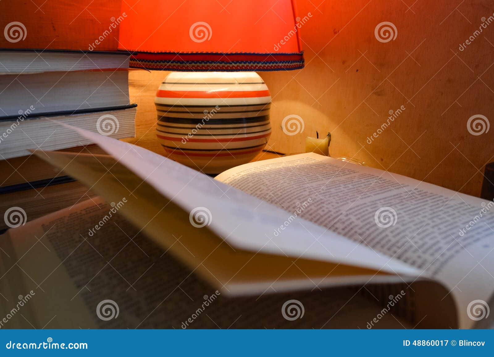 Open book and a table lamp stock image. Image of paper - 48860017