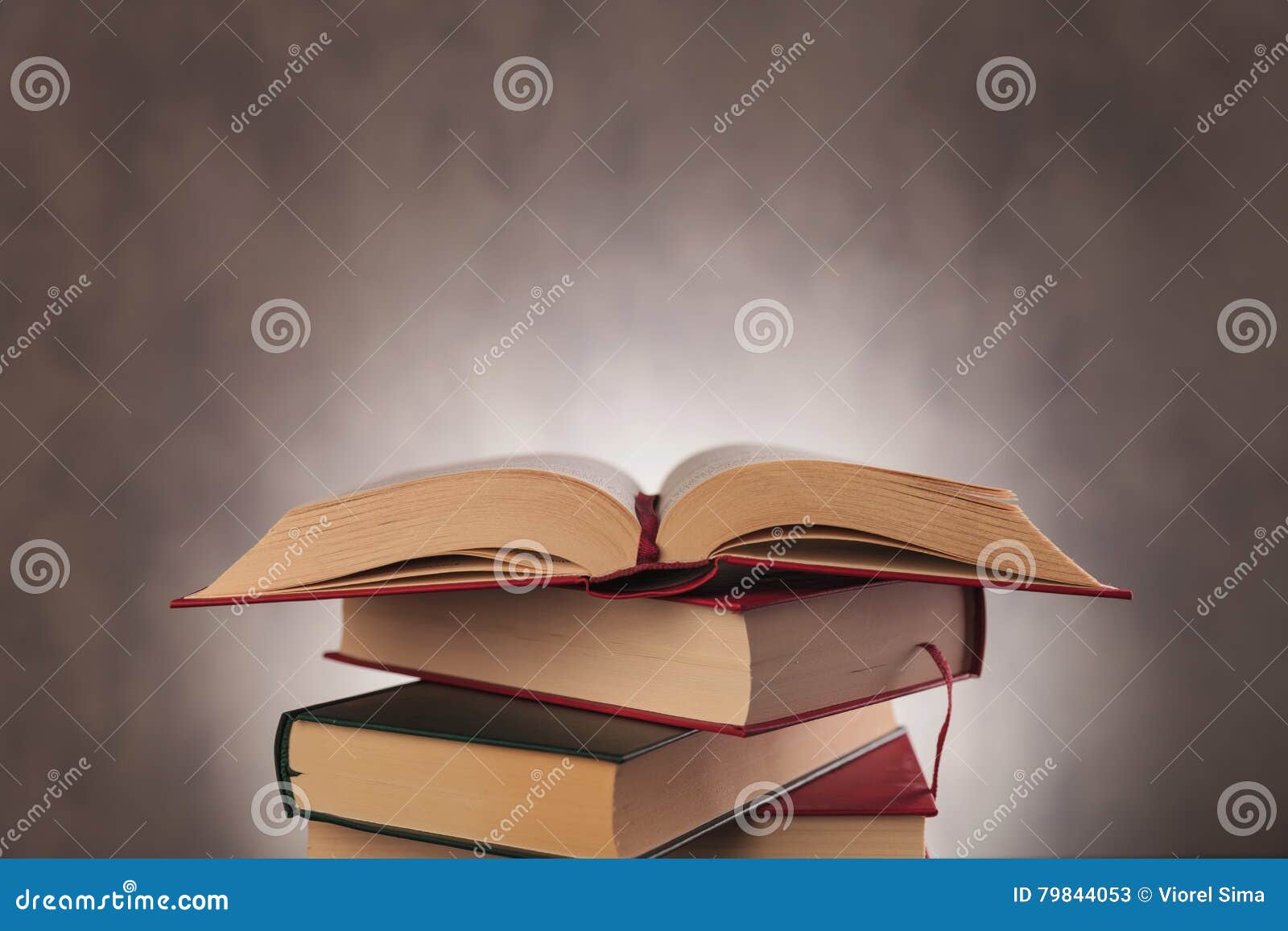 Open Book on Top of Pile of Books Stock Image - Image of bunch, pile ...