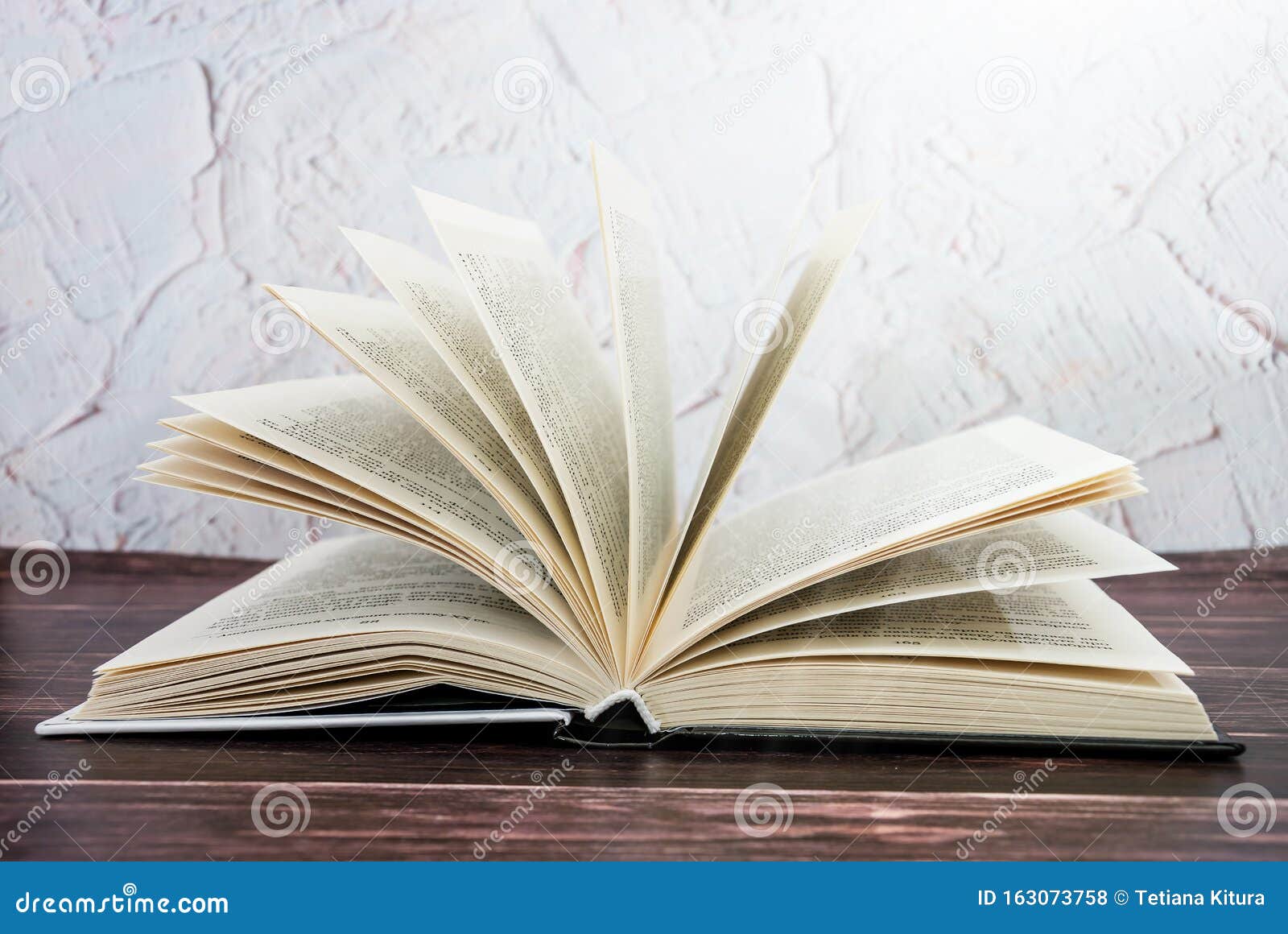 Open Book on a Wooden Table. Toned. Side View. Stock Photo - Image of ...