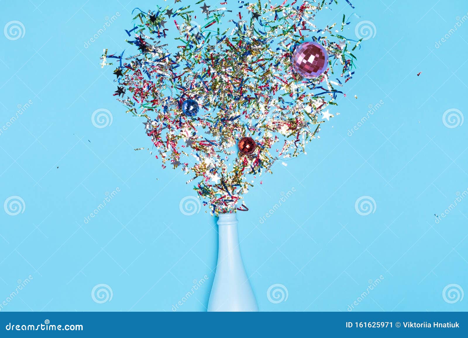 Open Bottle with Confetti Burst Isolated on Blue Top View Stock Image ...