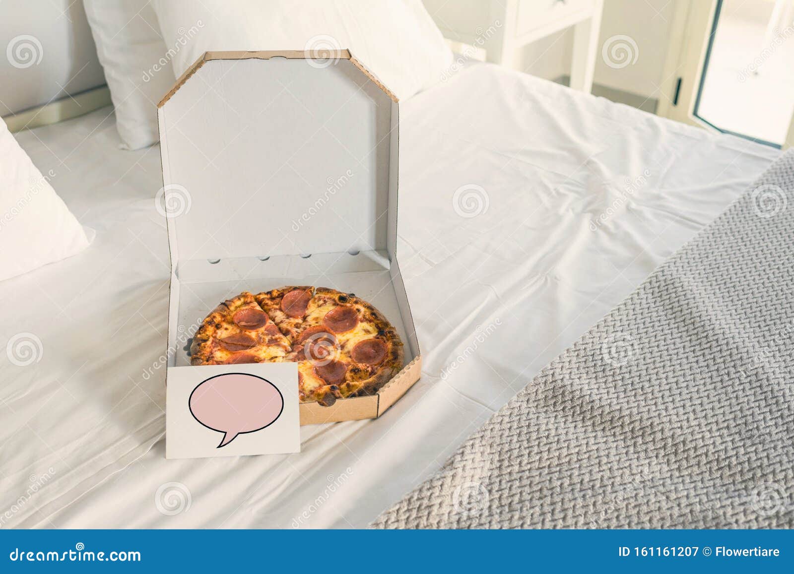 Open Box of Pizza on the Big Bed and Card with Cloud Thought for Text ...