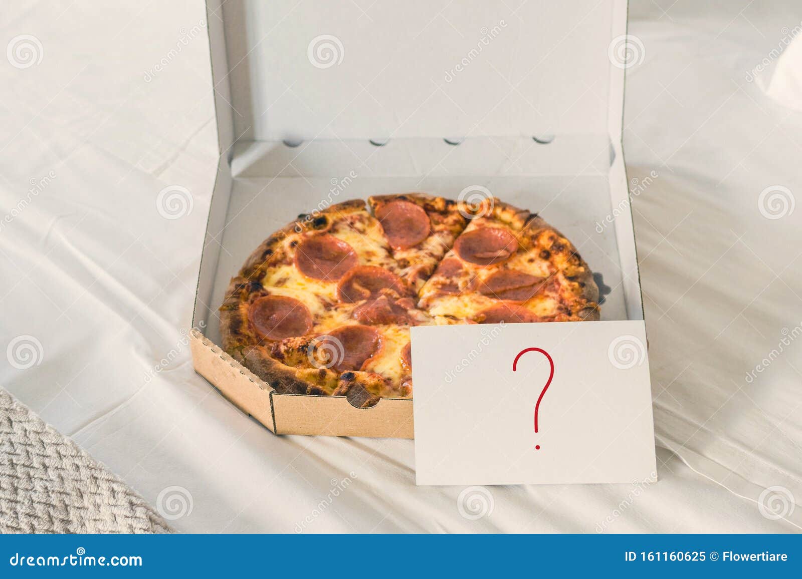 Open Box of Pizza on the Big Bed and Card with Question Mark. Concept ...