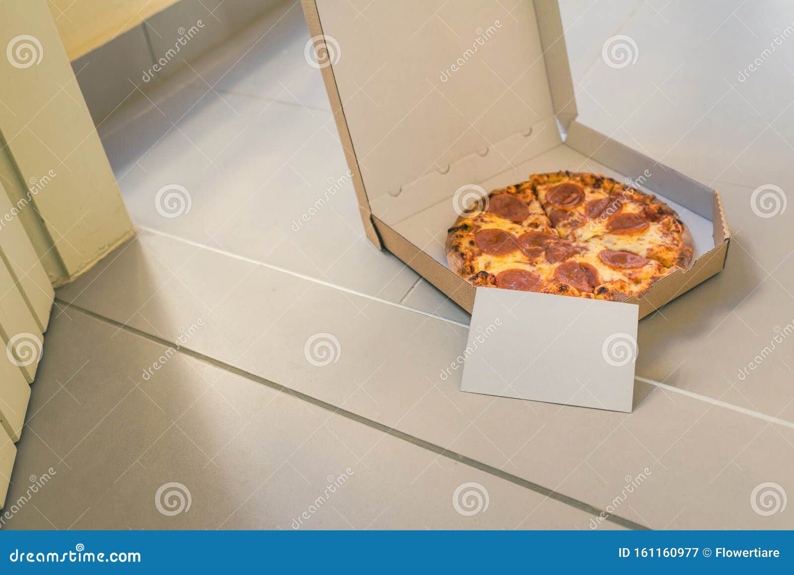 Open Box of Pizza with Empty Card for Text on Home Doorstep on Front ...