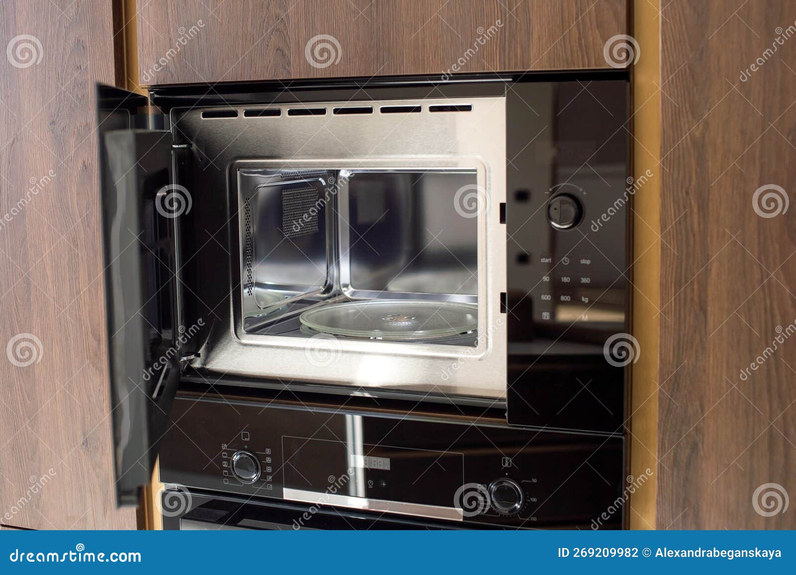 Open Built-in Microwave Oven in Wooden Kitchen Stock Photo - Image of ...