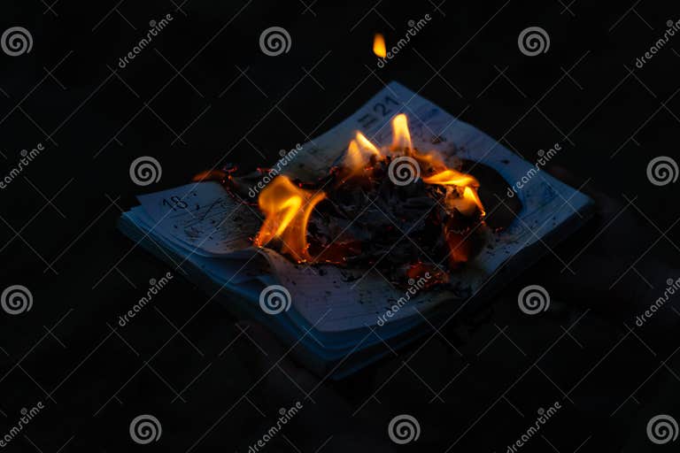 Open Burning Diary on Black Background. Notebook with Flame Cove Stock ...