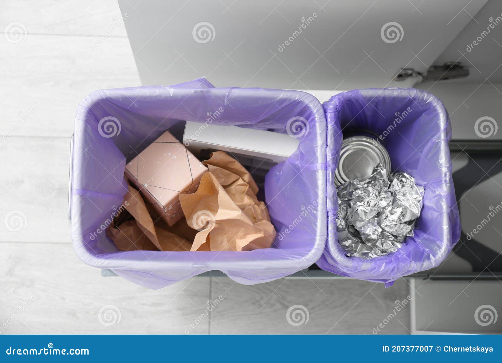 Open Cabinet with Full Trash Bins for Separate Waste Collection in ...