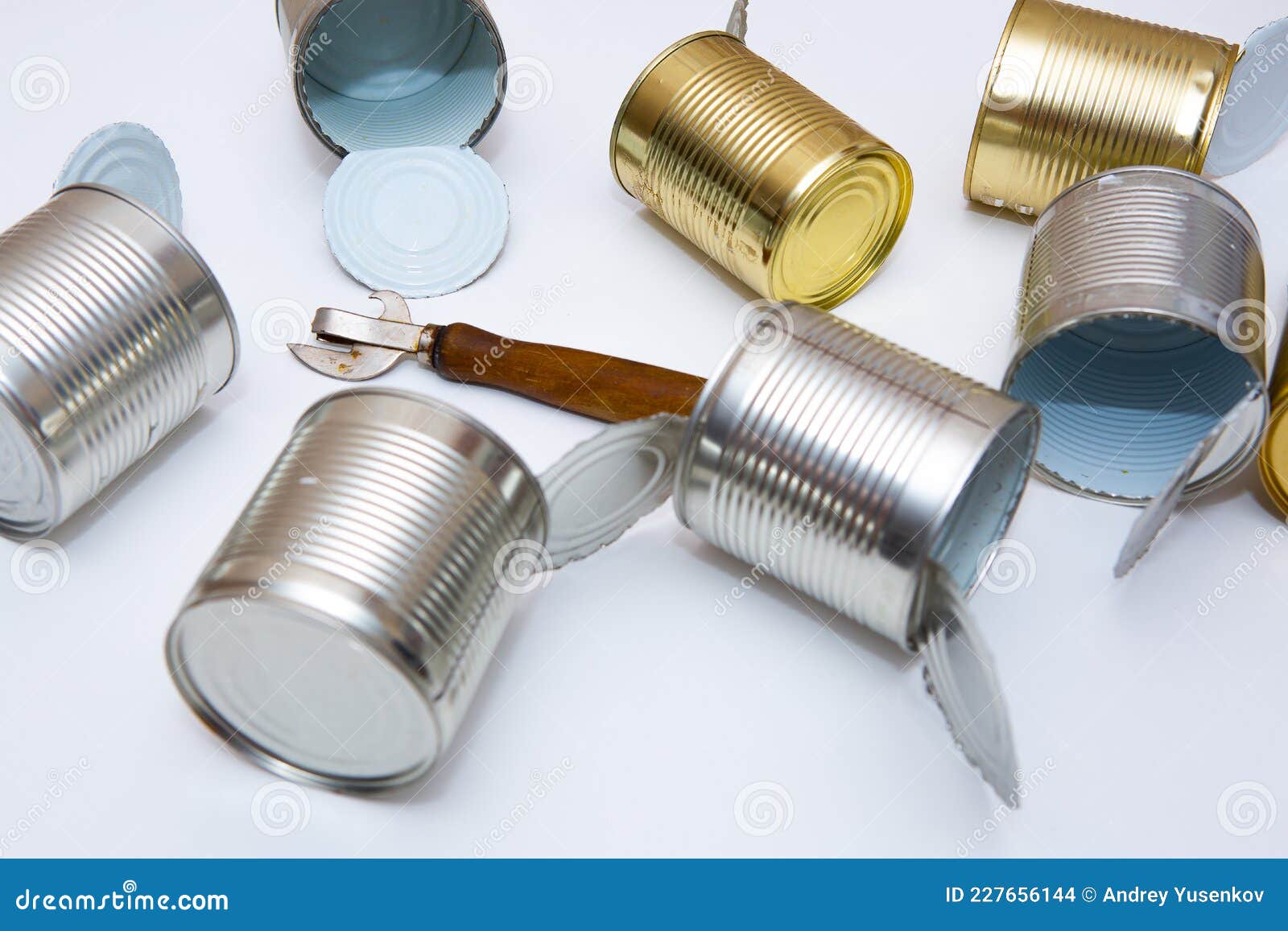 Open cans and a can opener stock photo. Image of isolated - 227656144
