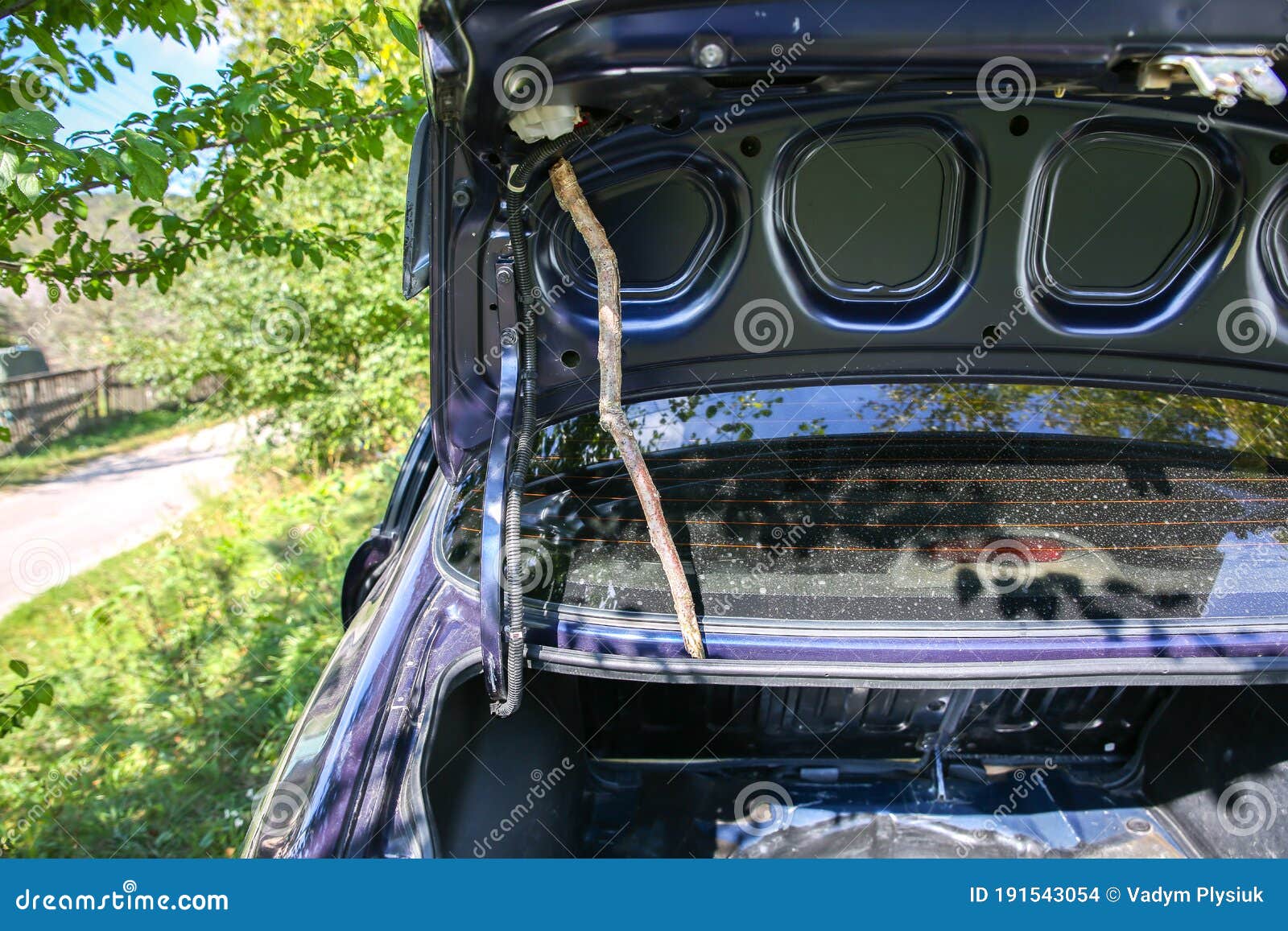Open Car Trunk with the Help of Wooden Stick Stock Photo - Image of ...