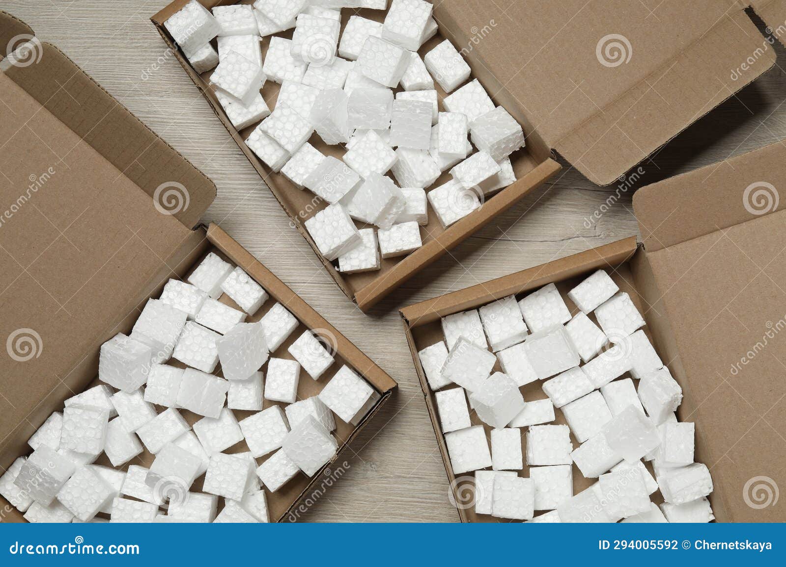 Open Cardboard Boxes with Pieces of Polystyrene Foam on Wooden Floor ...