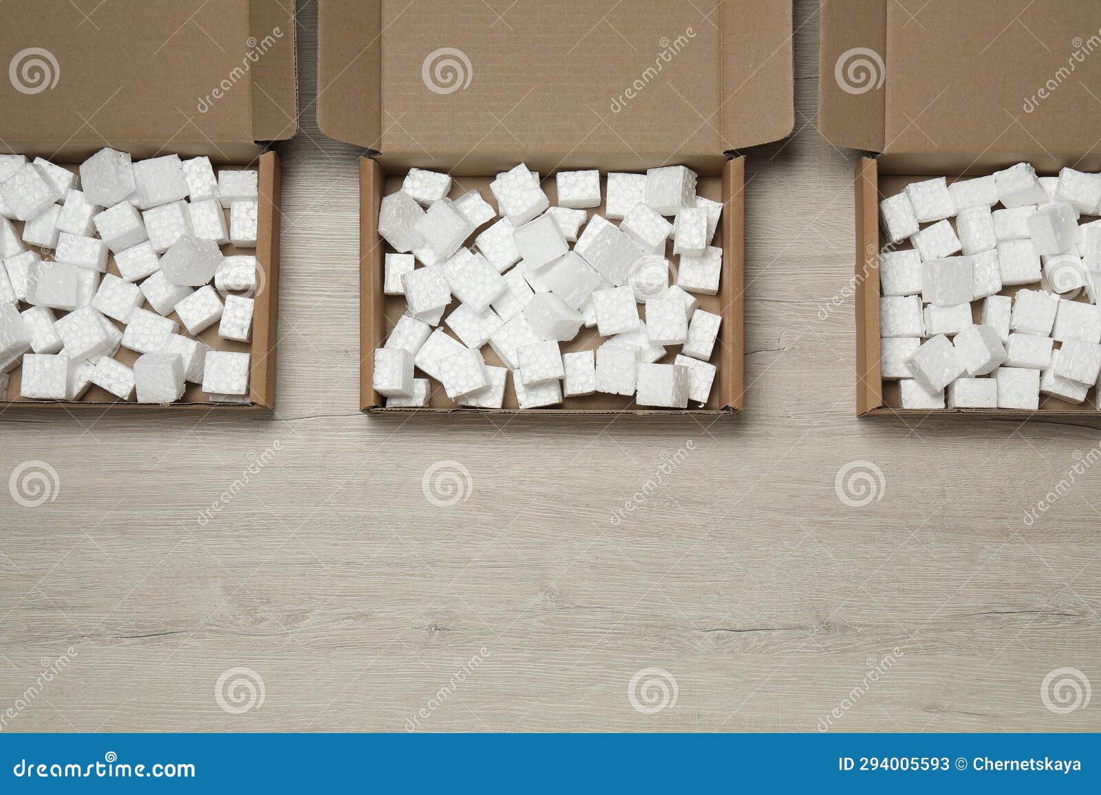 Open Cardboard Boxes with Pieces of Polystyrene Foam on Wooden Floor ...