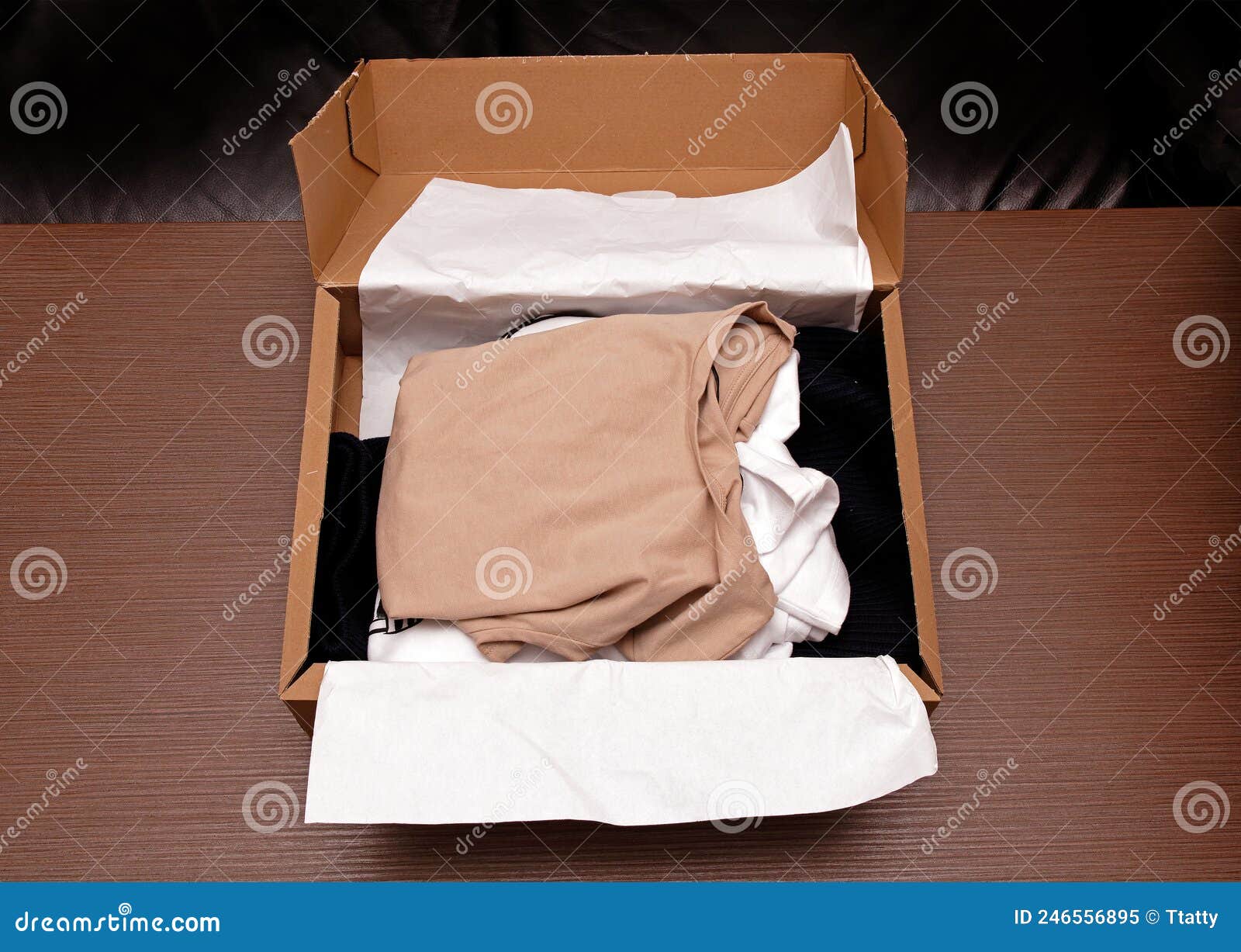 Open Cardboard with Clothes Delivery Stock Image - Image of pile ...