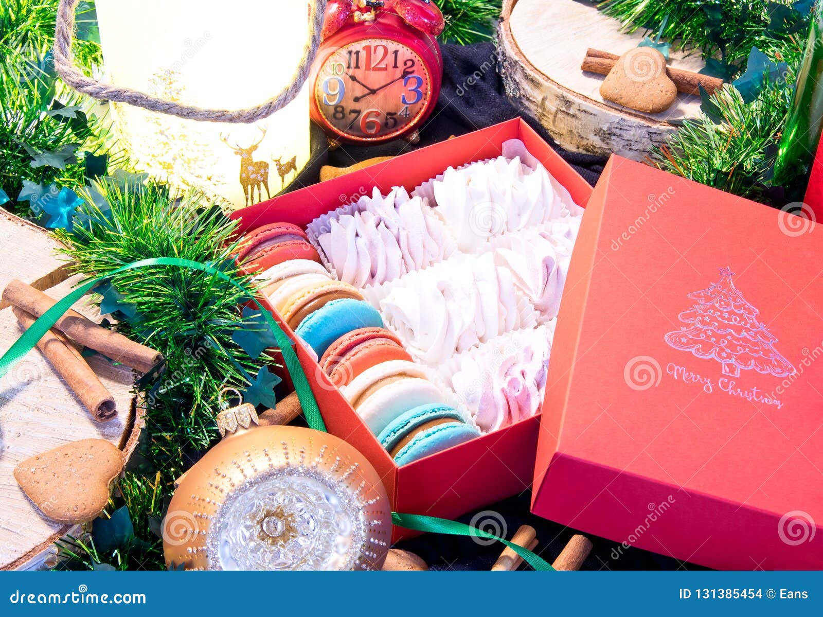 Open Christmas Box with Sweets and Christmas Decoration Around Stock ...