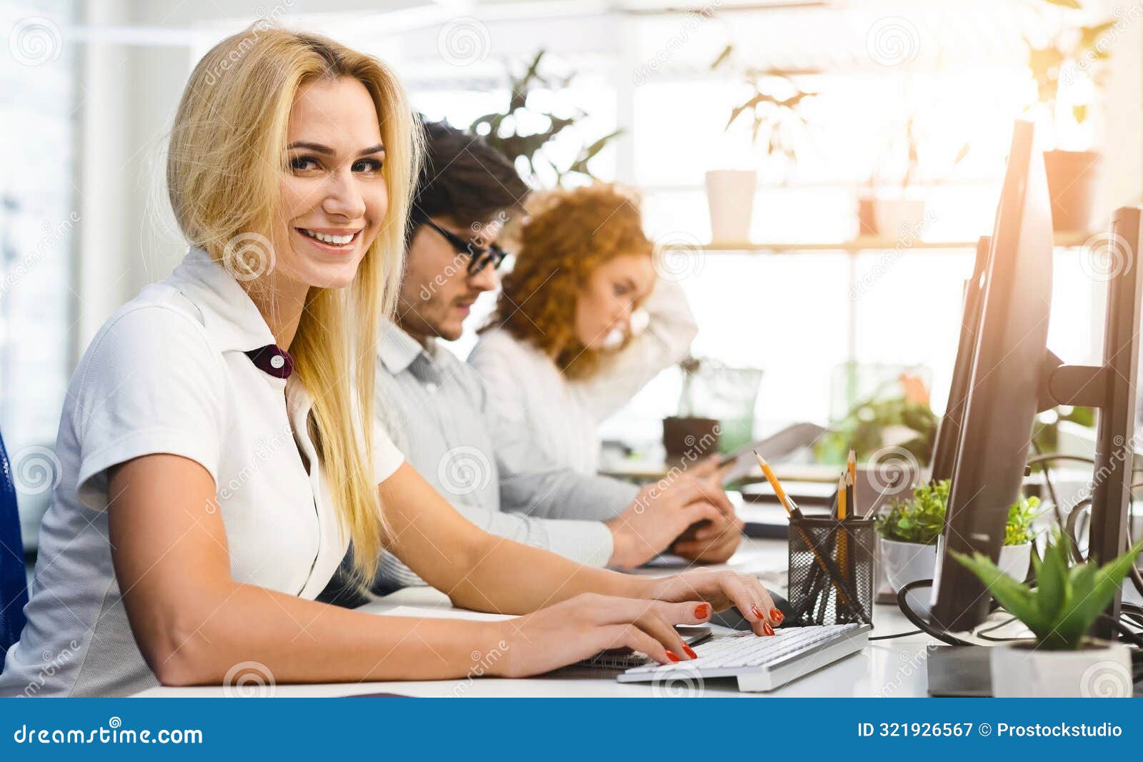 Open Concept Office with Young Employees Collaborating Stock Image ...