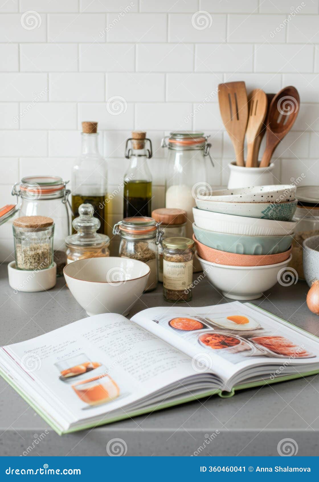 Open Cookbook with Ingredients and Kitchen Utensils on Modern ...