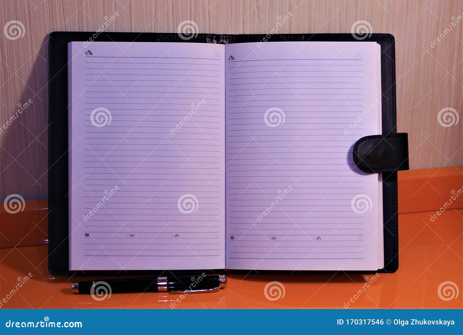 Open diary on orange table stock photo. Image of table - 170317546