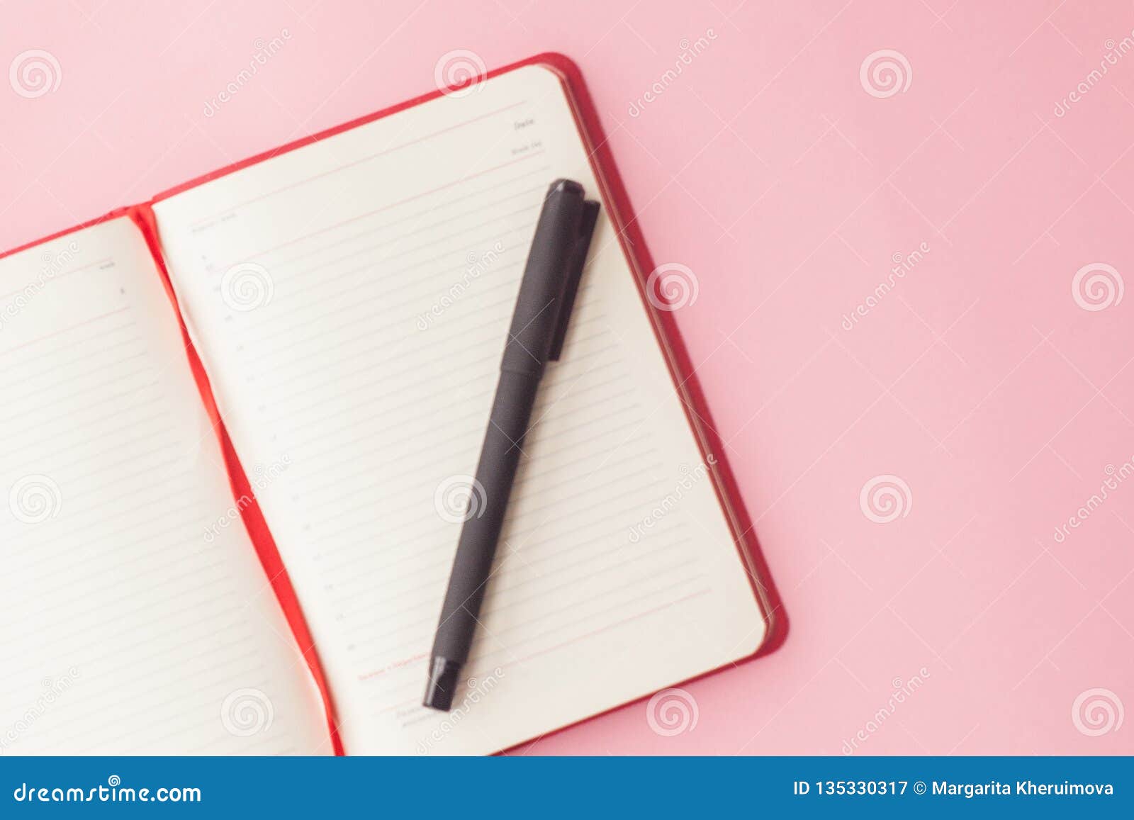 Open Diary with a Pen on a Pink Background. Top View. Selective Focus ...
