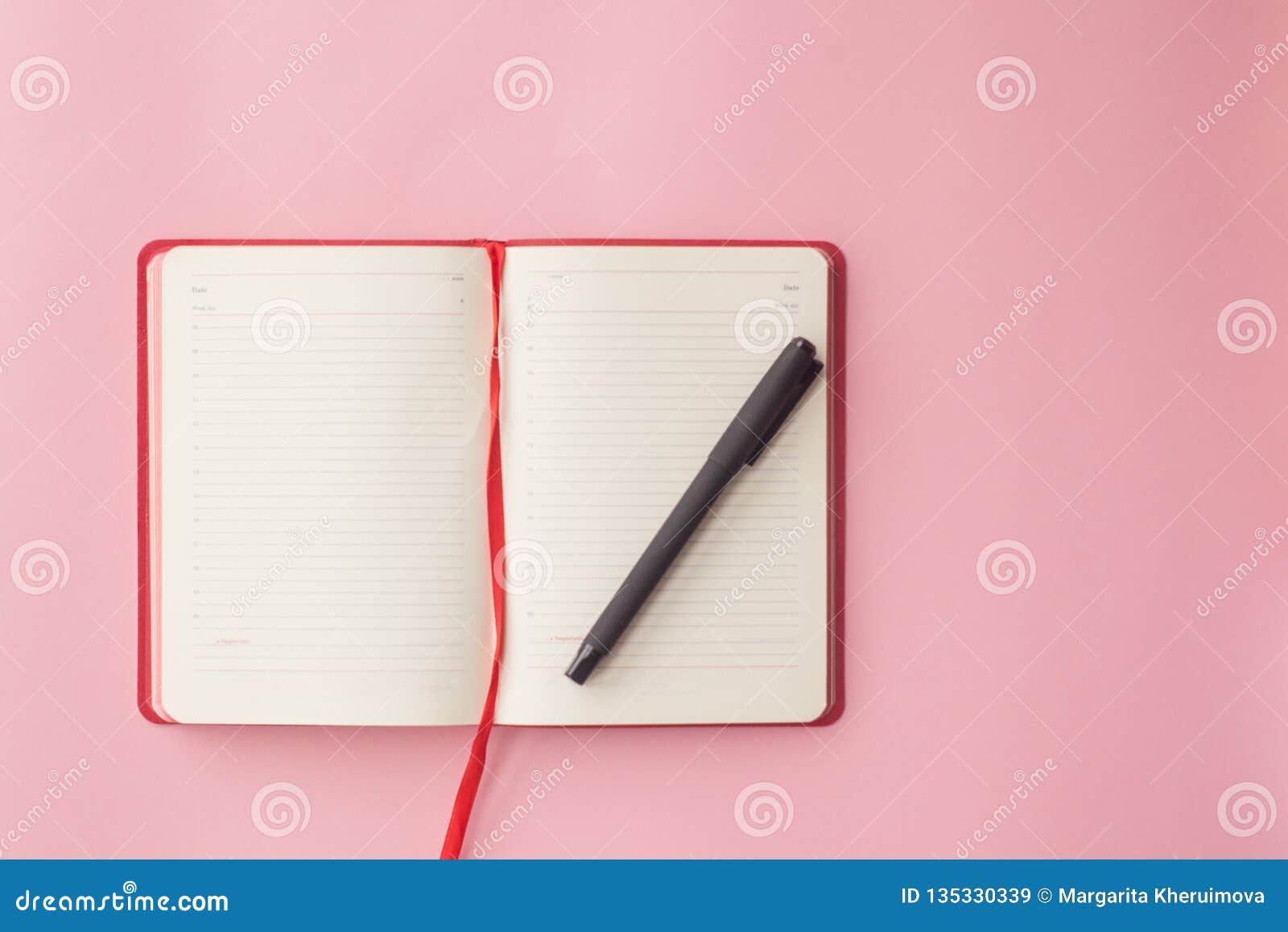 Open Diary with a Pen on a Pink Background. Top View. Selective Focus ...