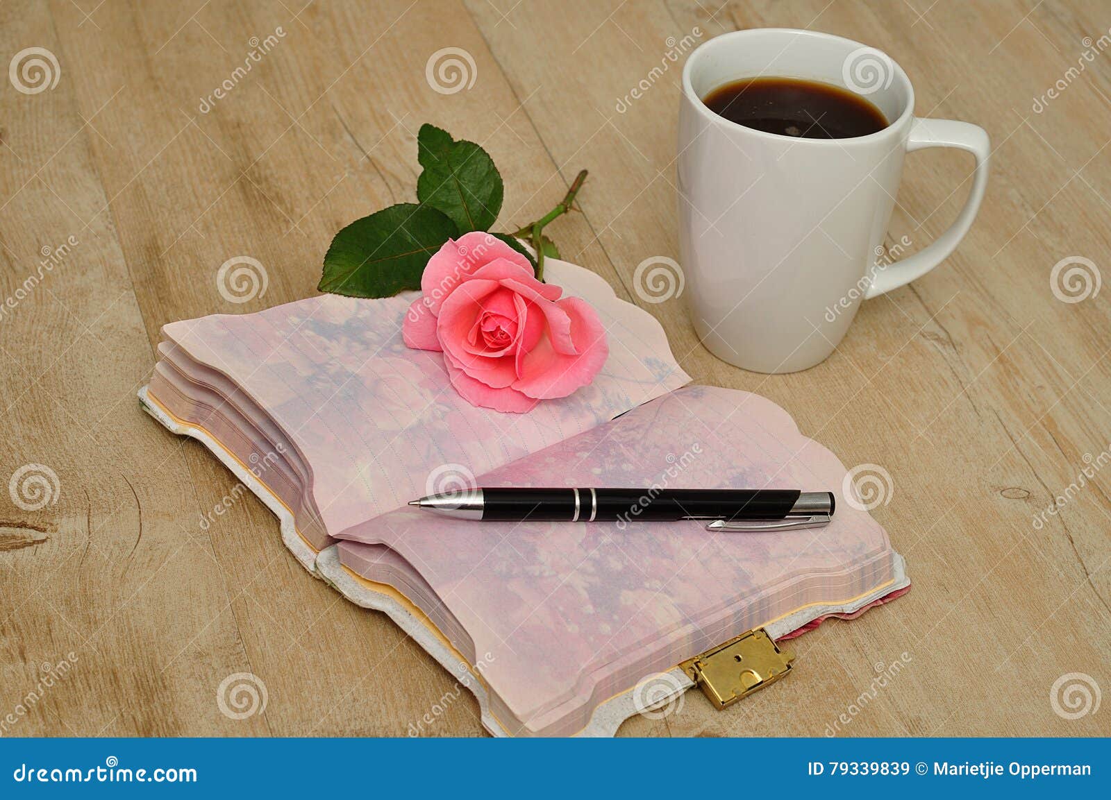 Open Diary on a Wooden Table with a Pink Rose, Pen and a Mug Stock ...