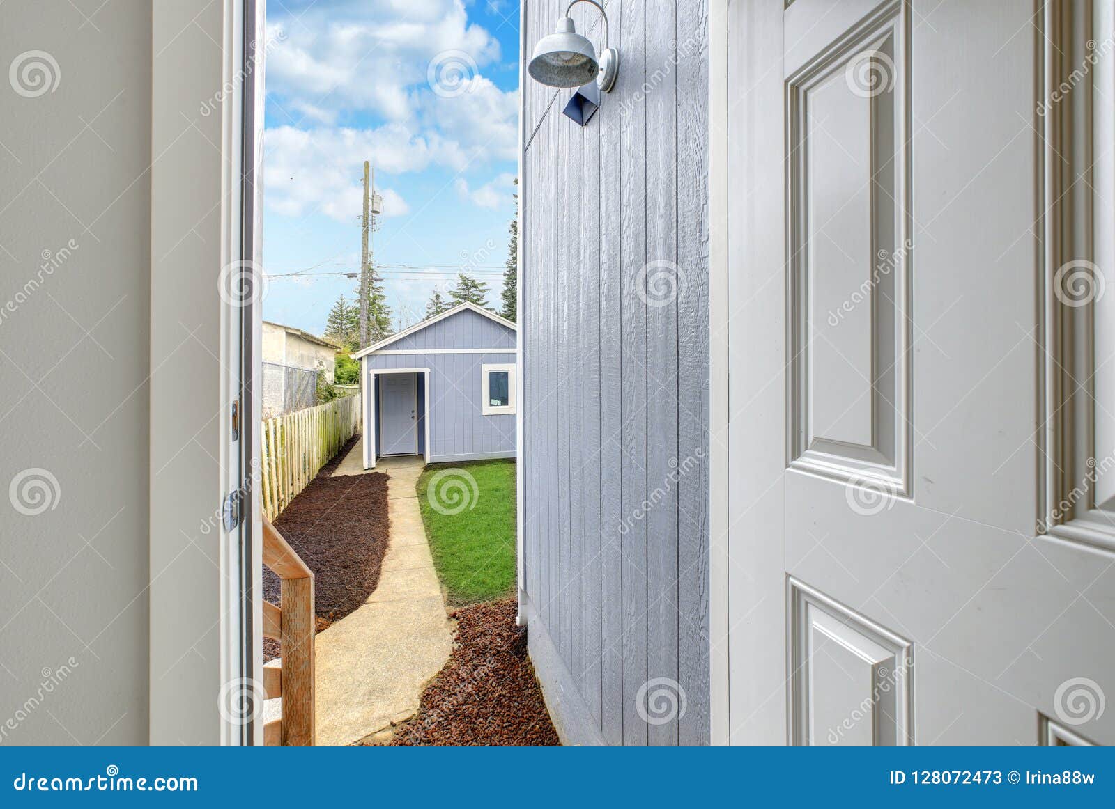 Open Door To a Back Yard with View of One Car Garage. Stock Image ...