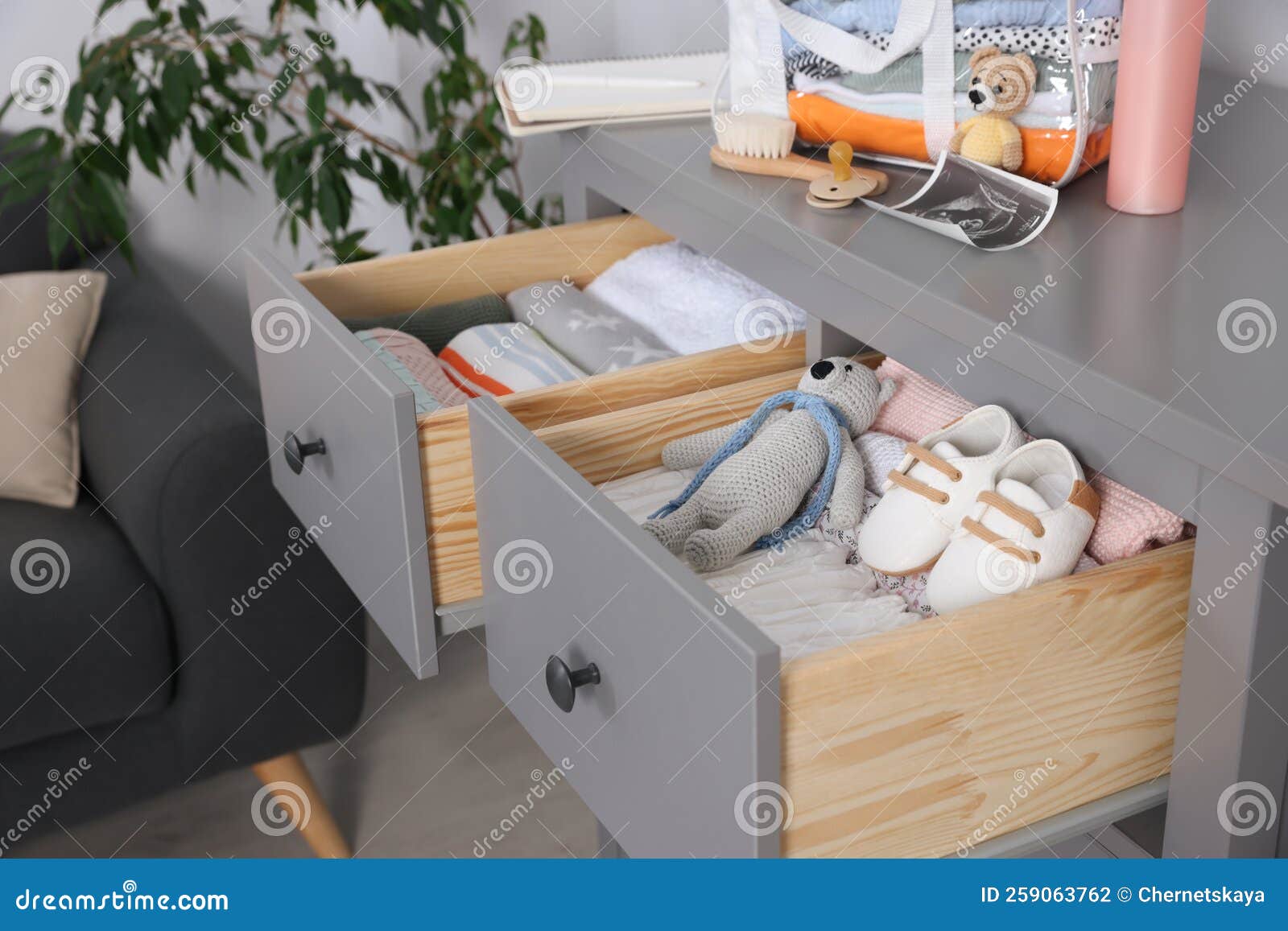 Open Drawers of Chest with Baby Stuff in Room Stock Photo - Image of ...