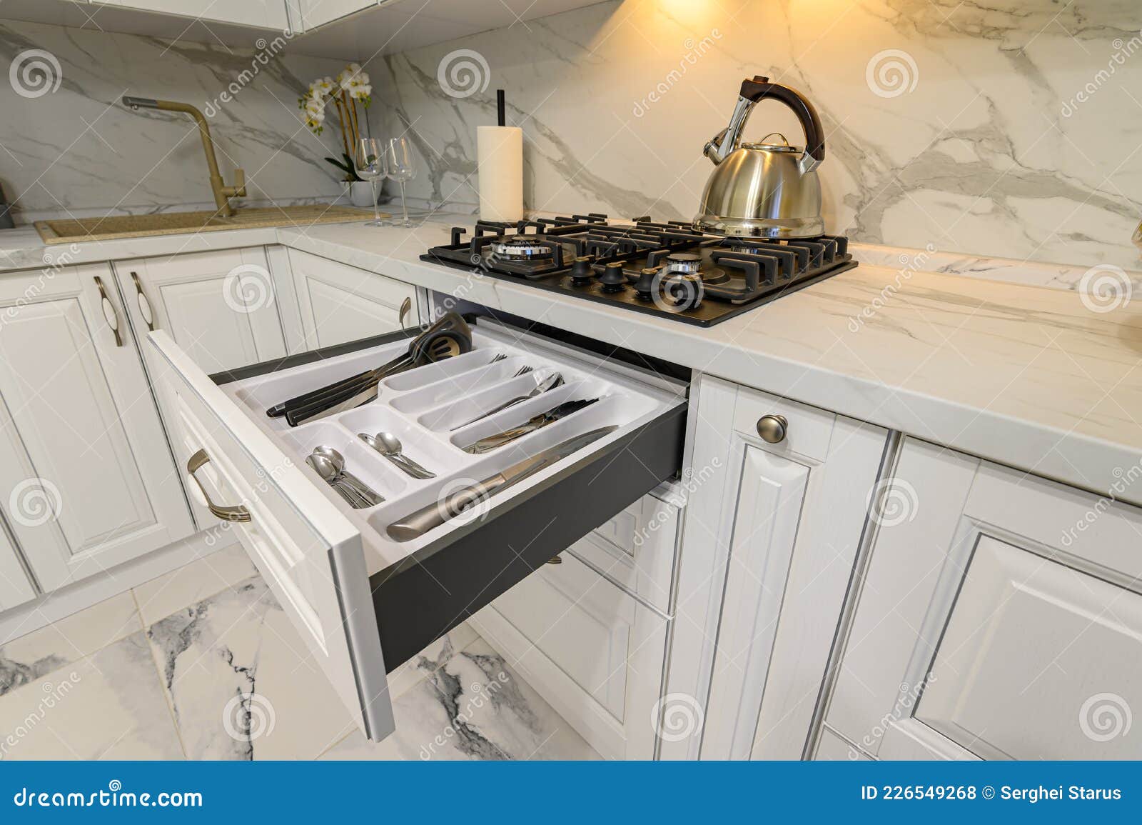 Open Drawers with Kitchenware at Modern White Kitchen Stock Photo ...
