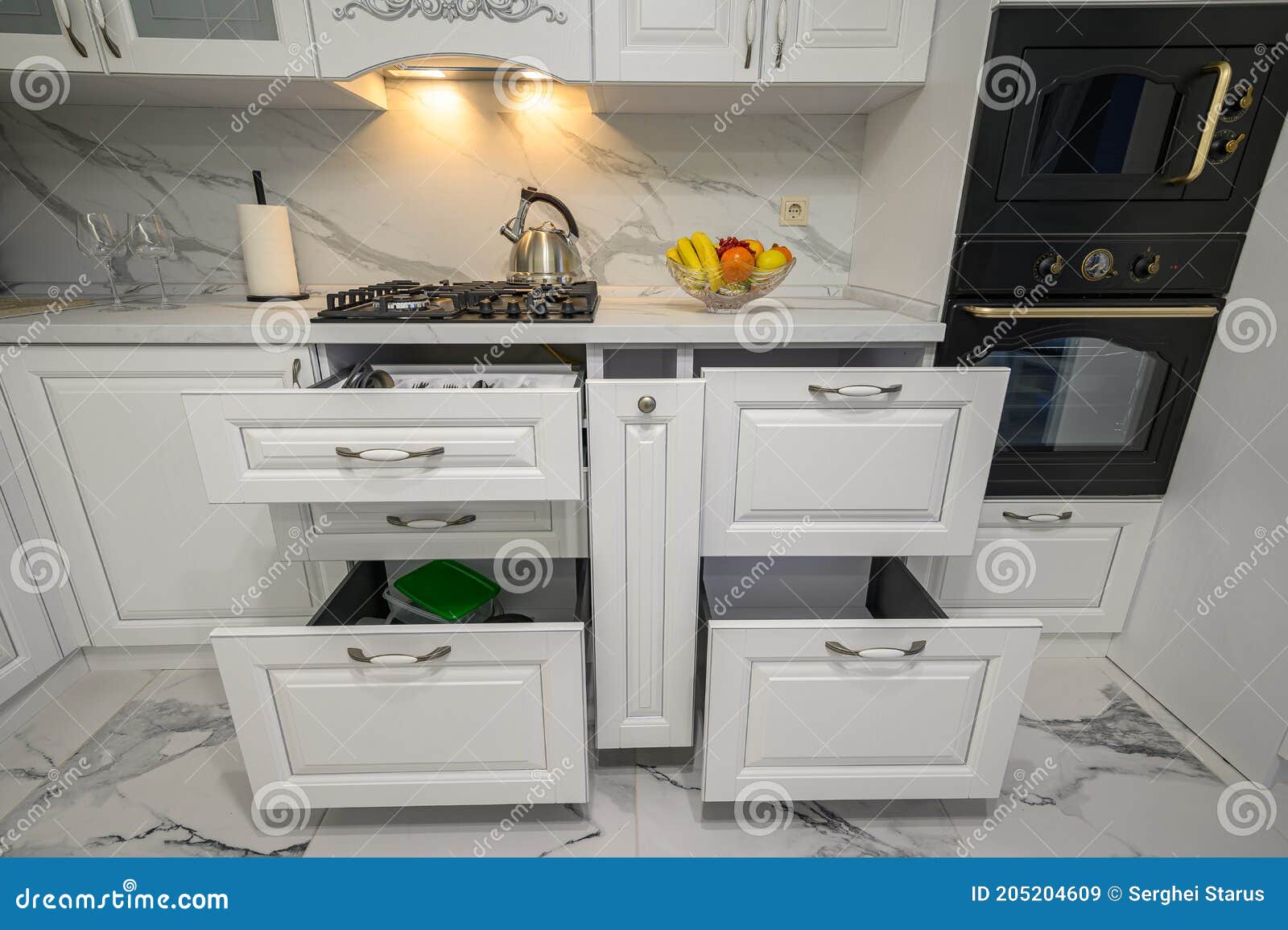Open Drawers with Kitchenware at Modern White Kitchen Stock Image ...