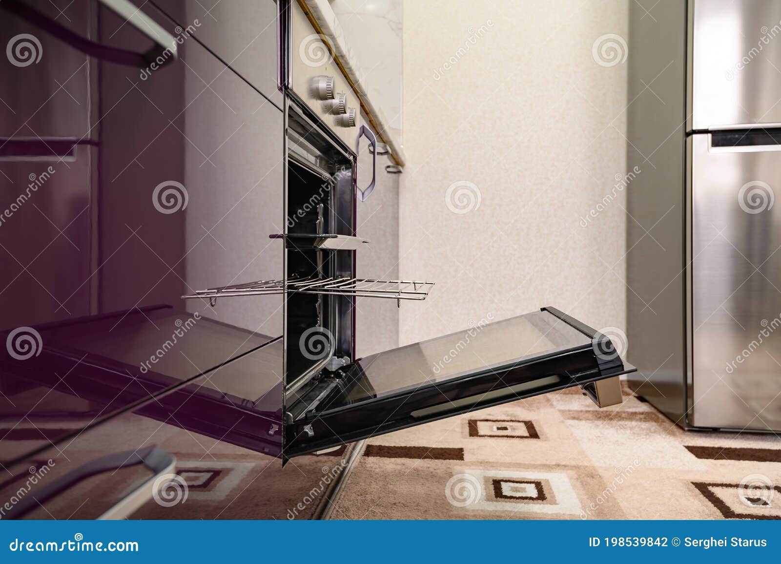 Open Electric Oven at Maroon and White Modern Kitchen Stock Photo ...