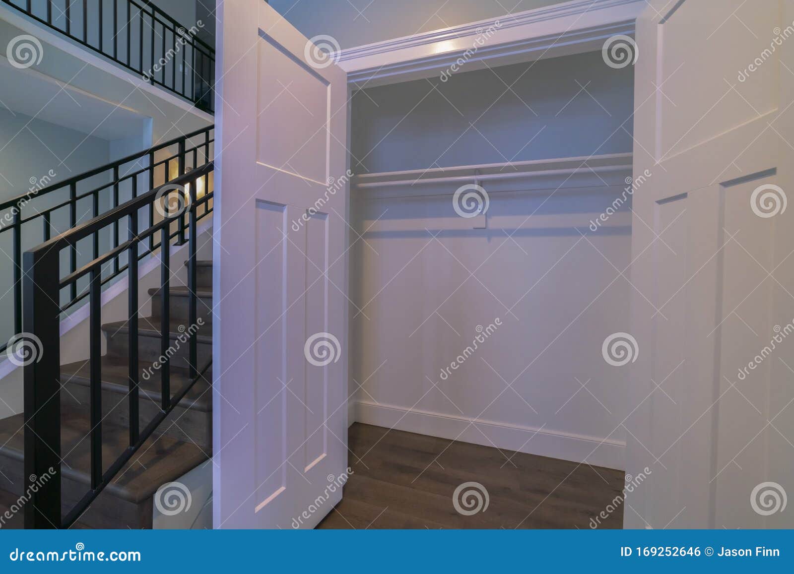 Open Empty Cupboard Door with Rails Bright Interior Stock Photo - Image ...