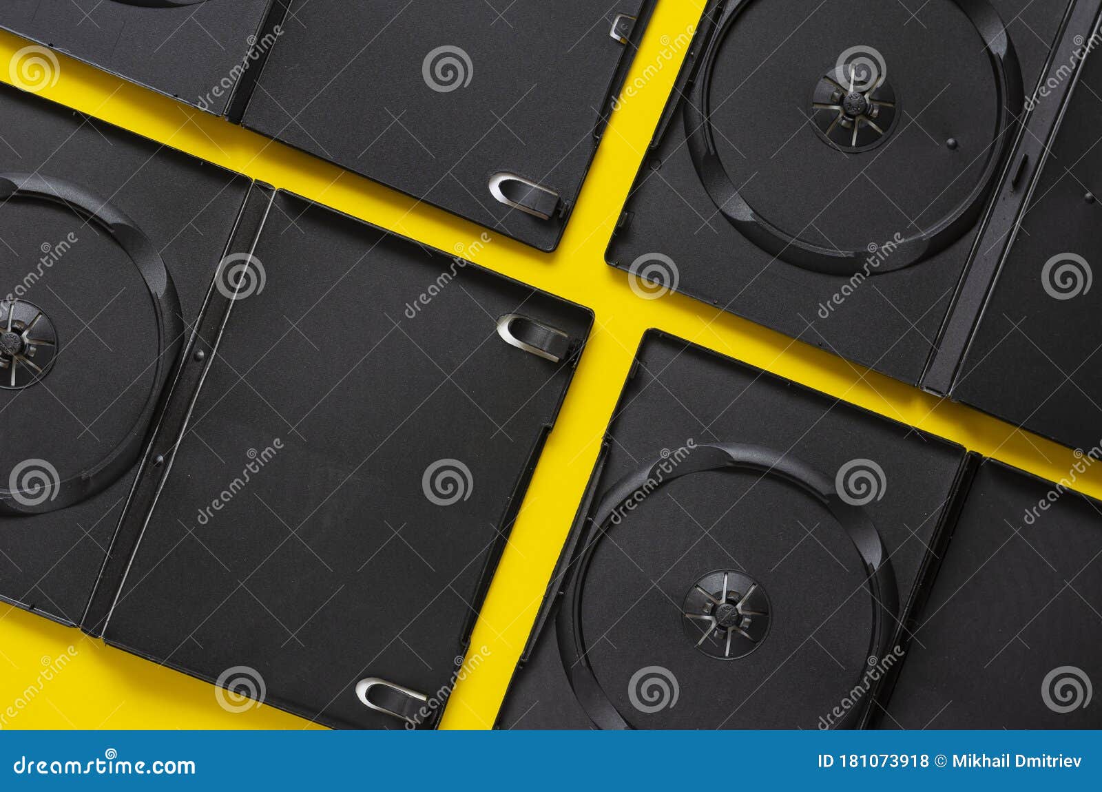 Open Empty DVD Boxes on a Yellow Background Stock Photo - Image of ...