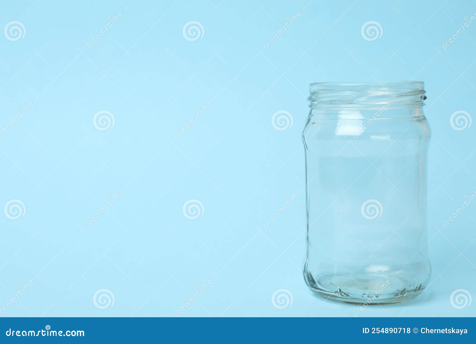 Open Empty Glass Jar on Blue Background, Space for Text Stock Photo ...