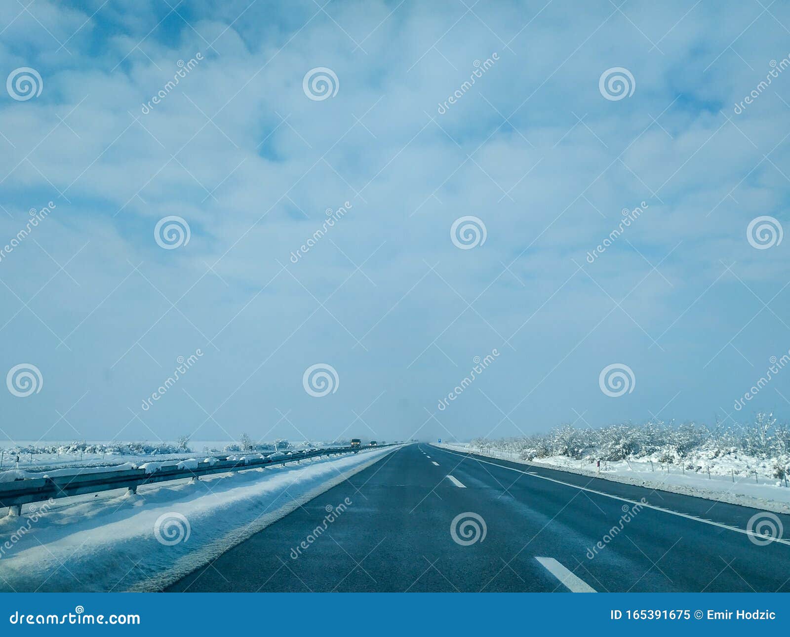Open Empty Road during Winter Season and Snow on the Side on a Cold Day ...